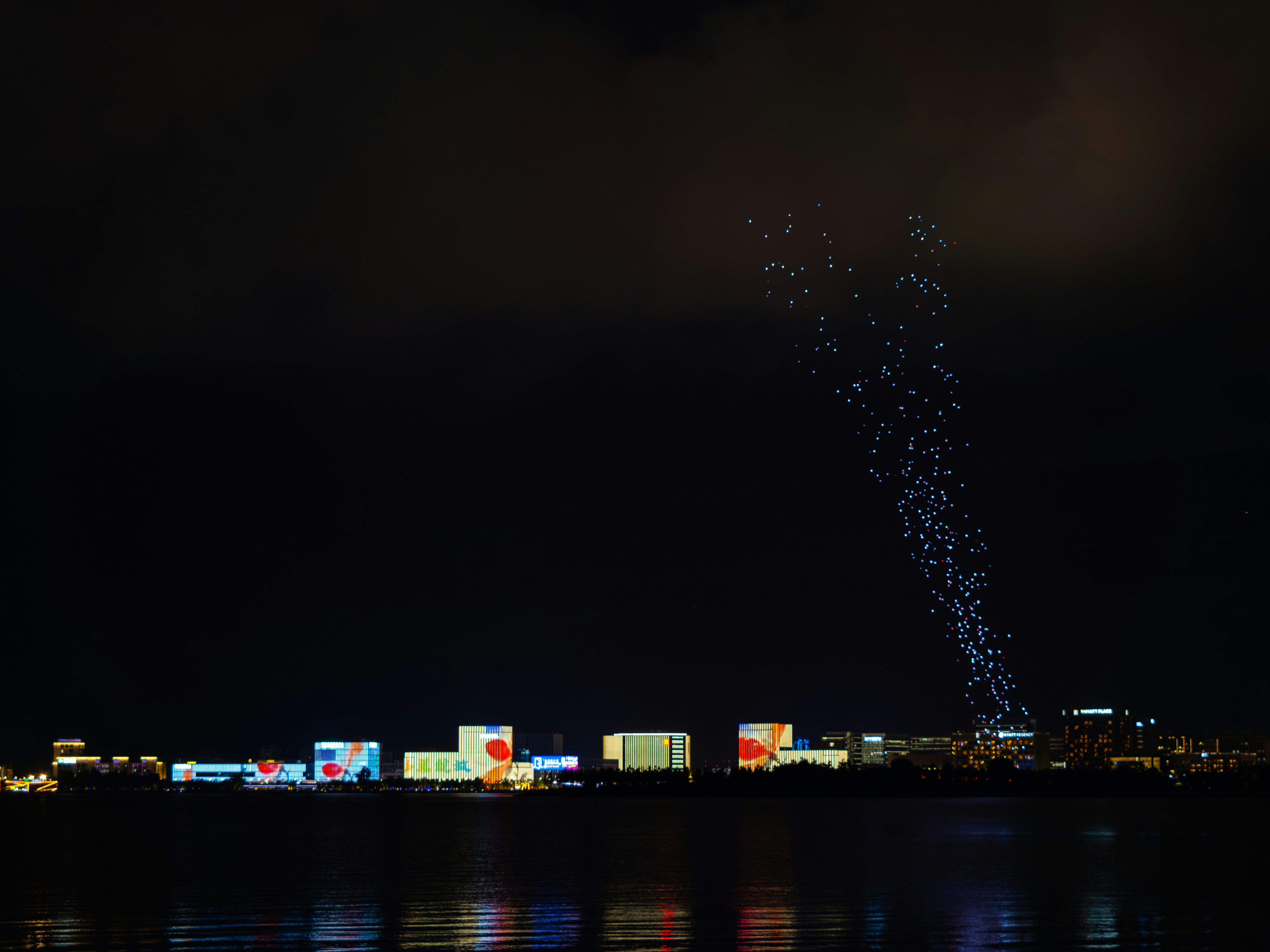 Firework Echoes Over the Waterfront Neon