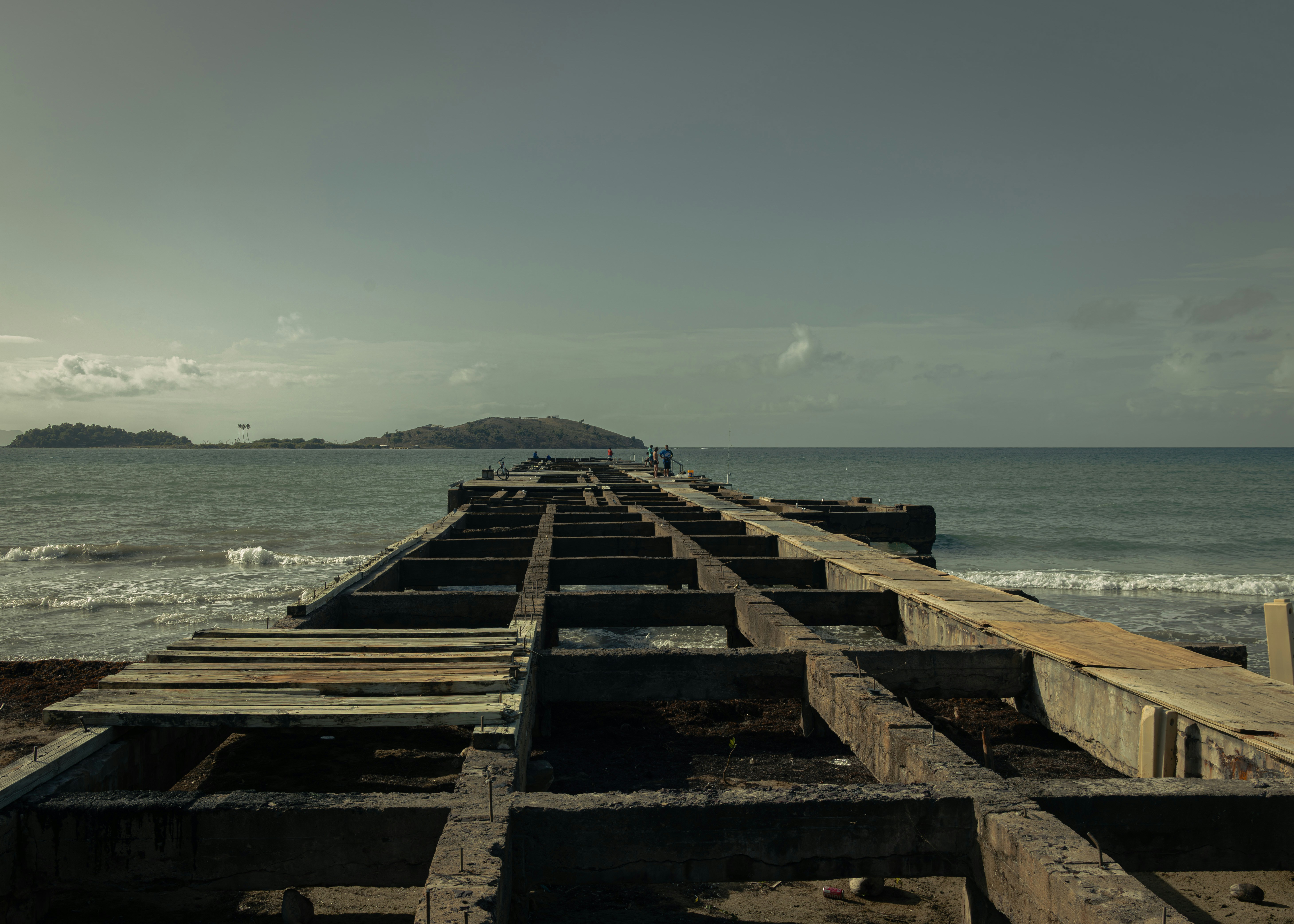 Skyline of a Pier: Converging Wooden Slabs Toward the Horizon