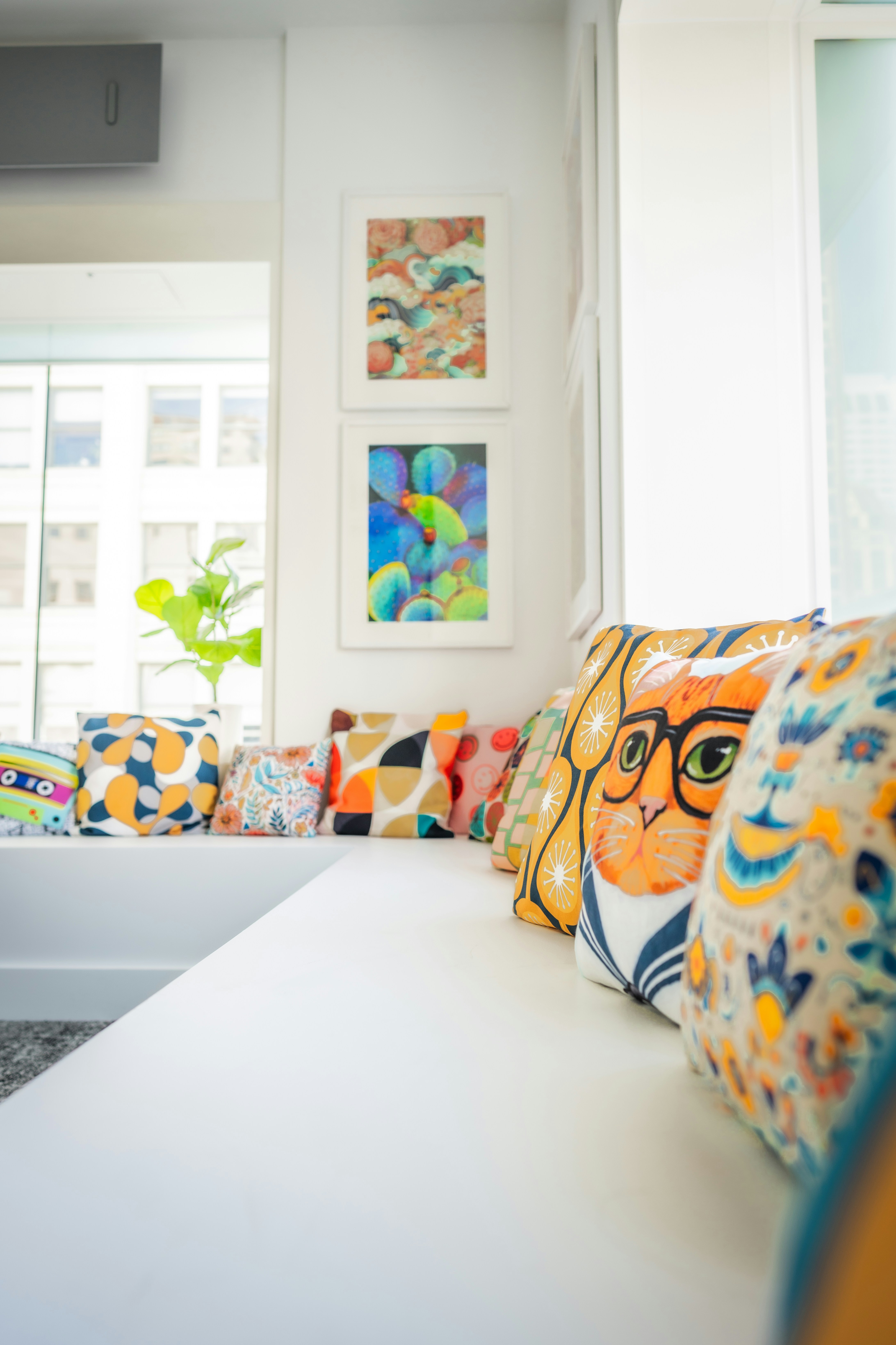 Sunny Windowsill Sofa: Playful Colorful Cushions in a Bright Living Nook