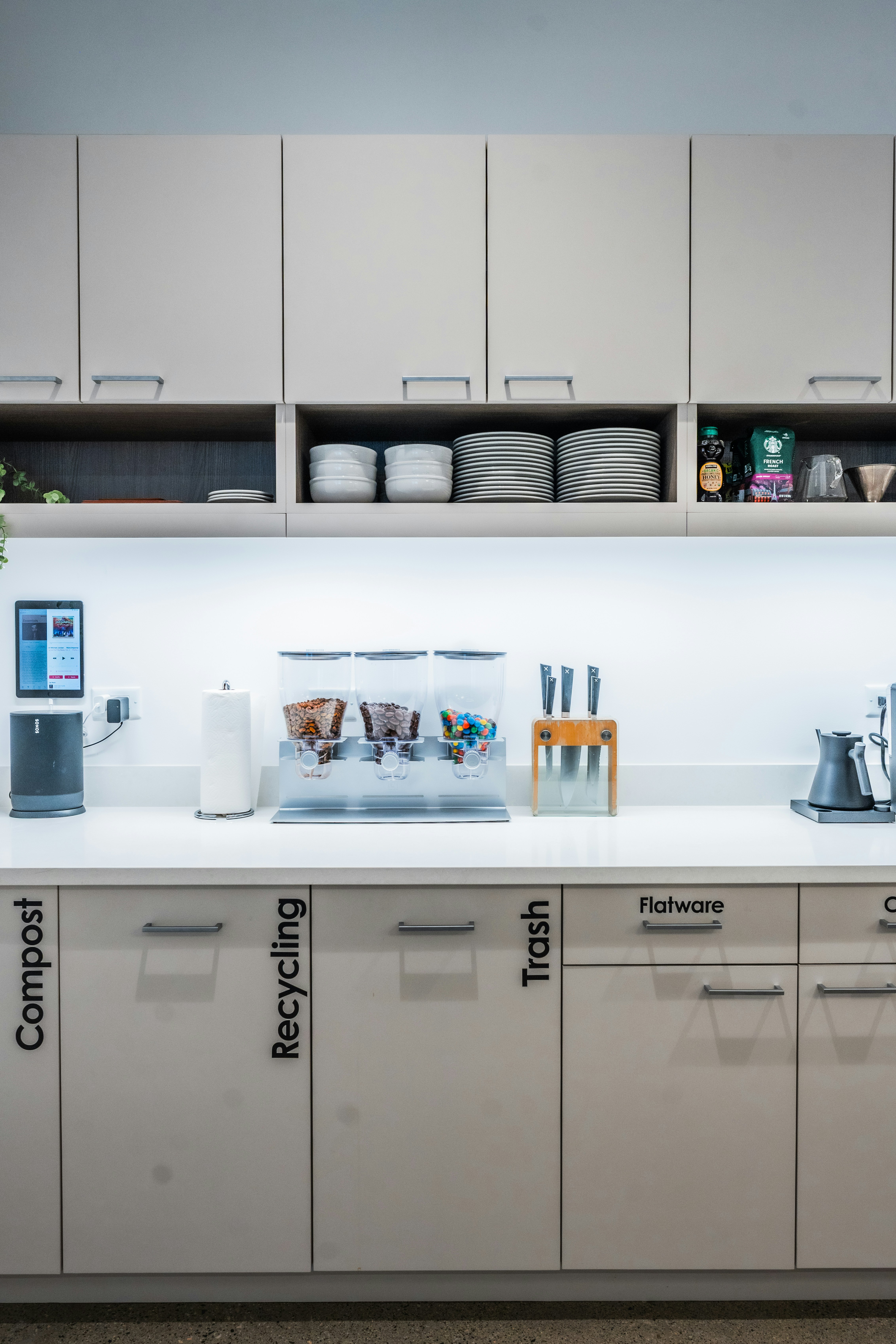 Neat Rows of Kitchen Cabinets and Coffee Station