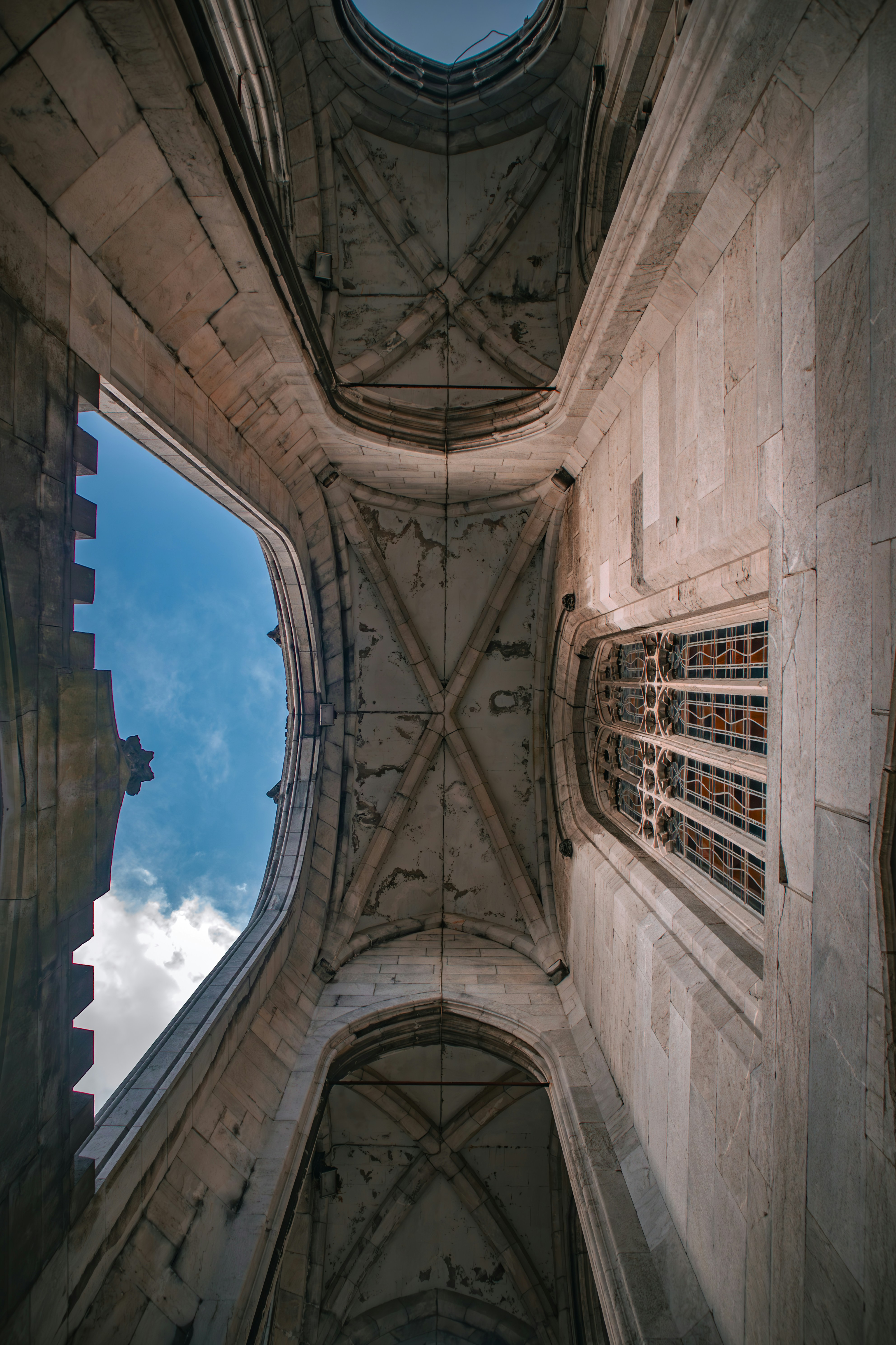 Vaulted Silence: Night-Worn Stone Reaches Toward a Narrow Sky