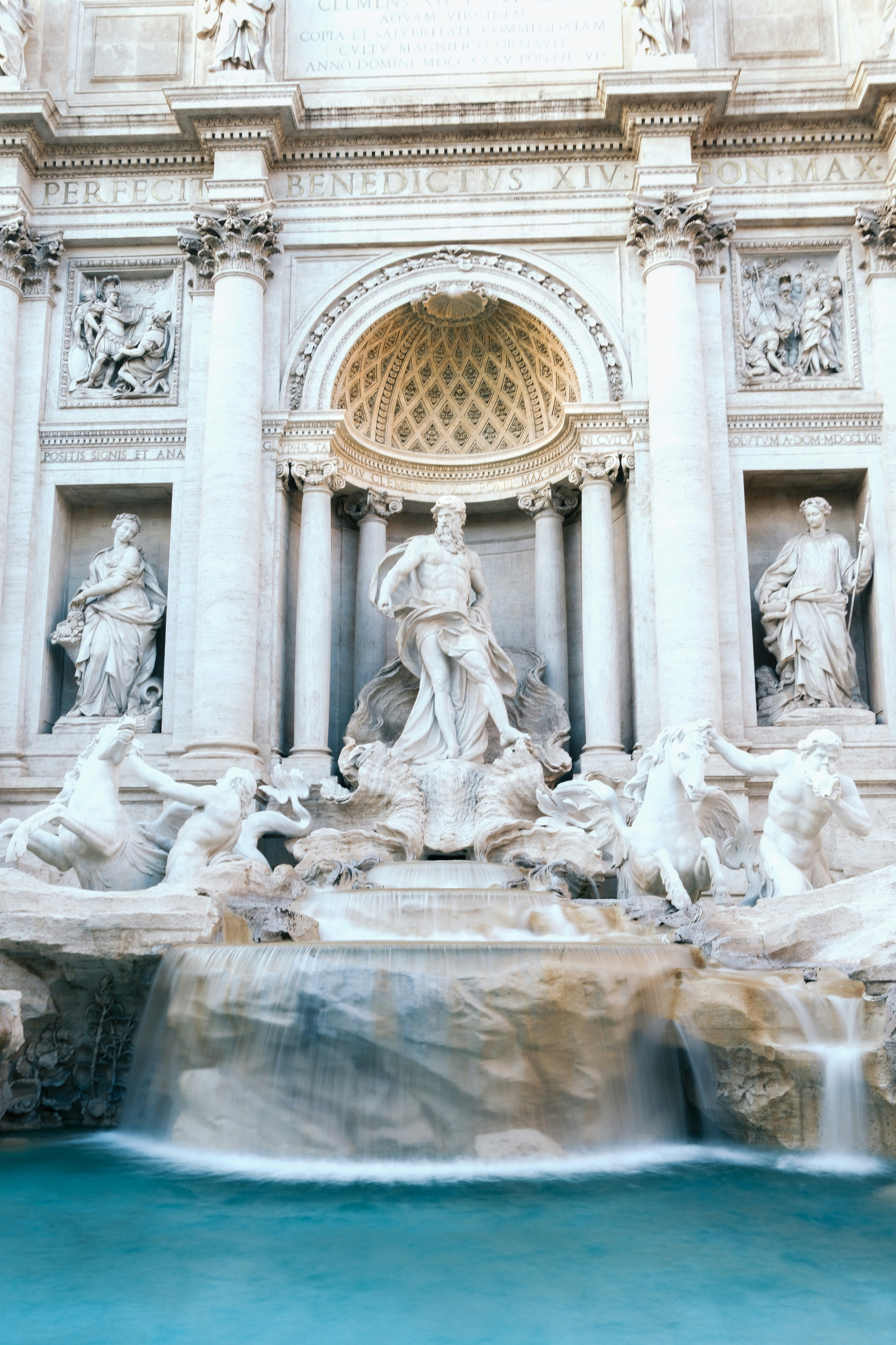 Triumphant Fountain: Sculpted Carvings Framing a Central Statue