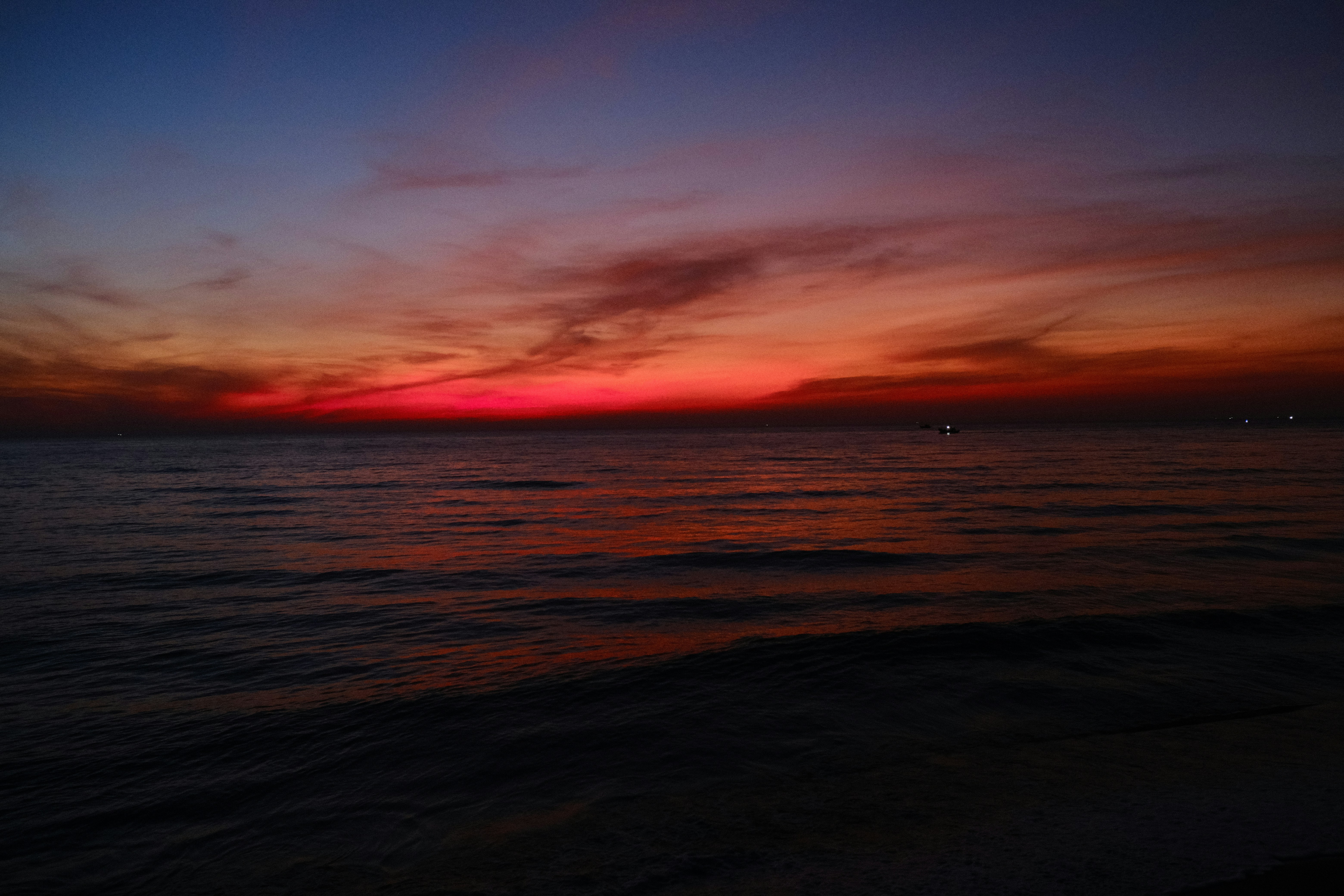 Crimson Horizon Over Quiet Tide