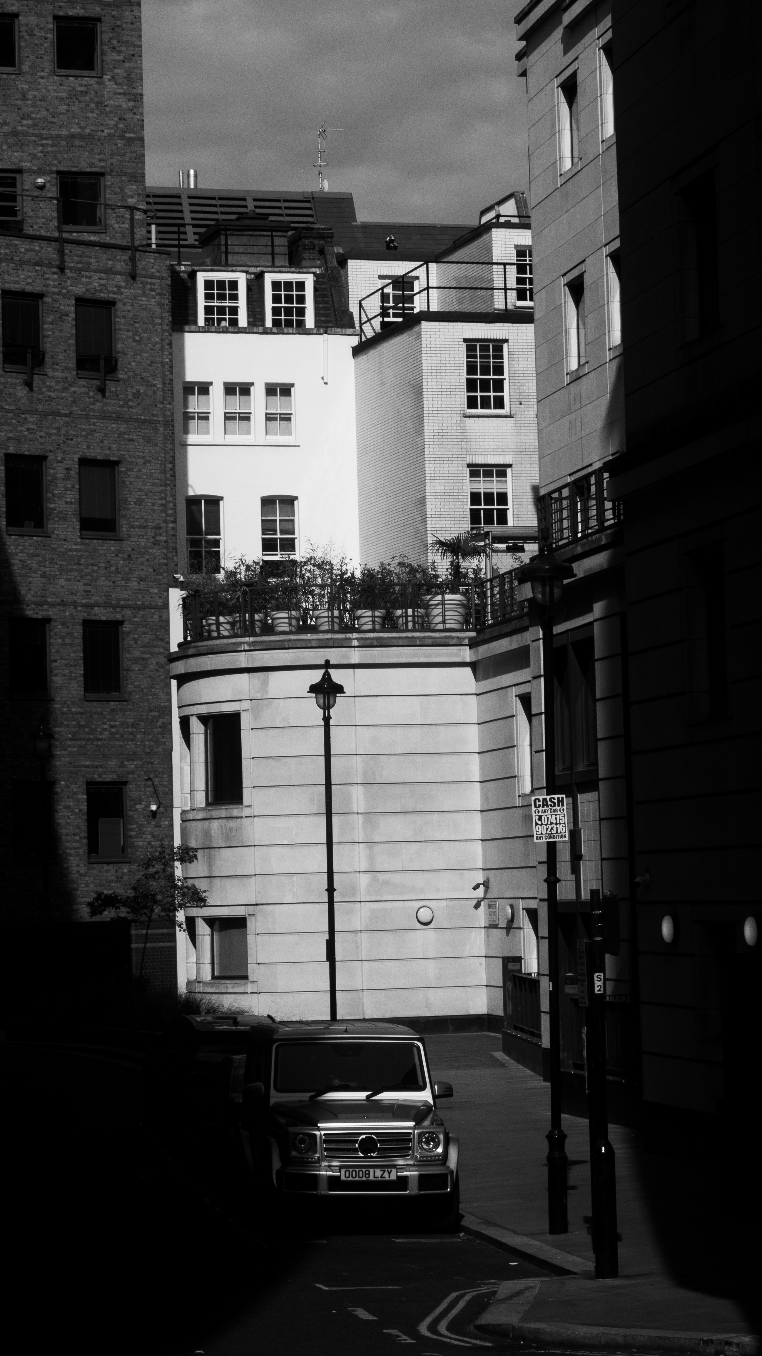 City Canyon: A Narrow Street Framed by Towering Facades