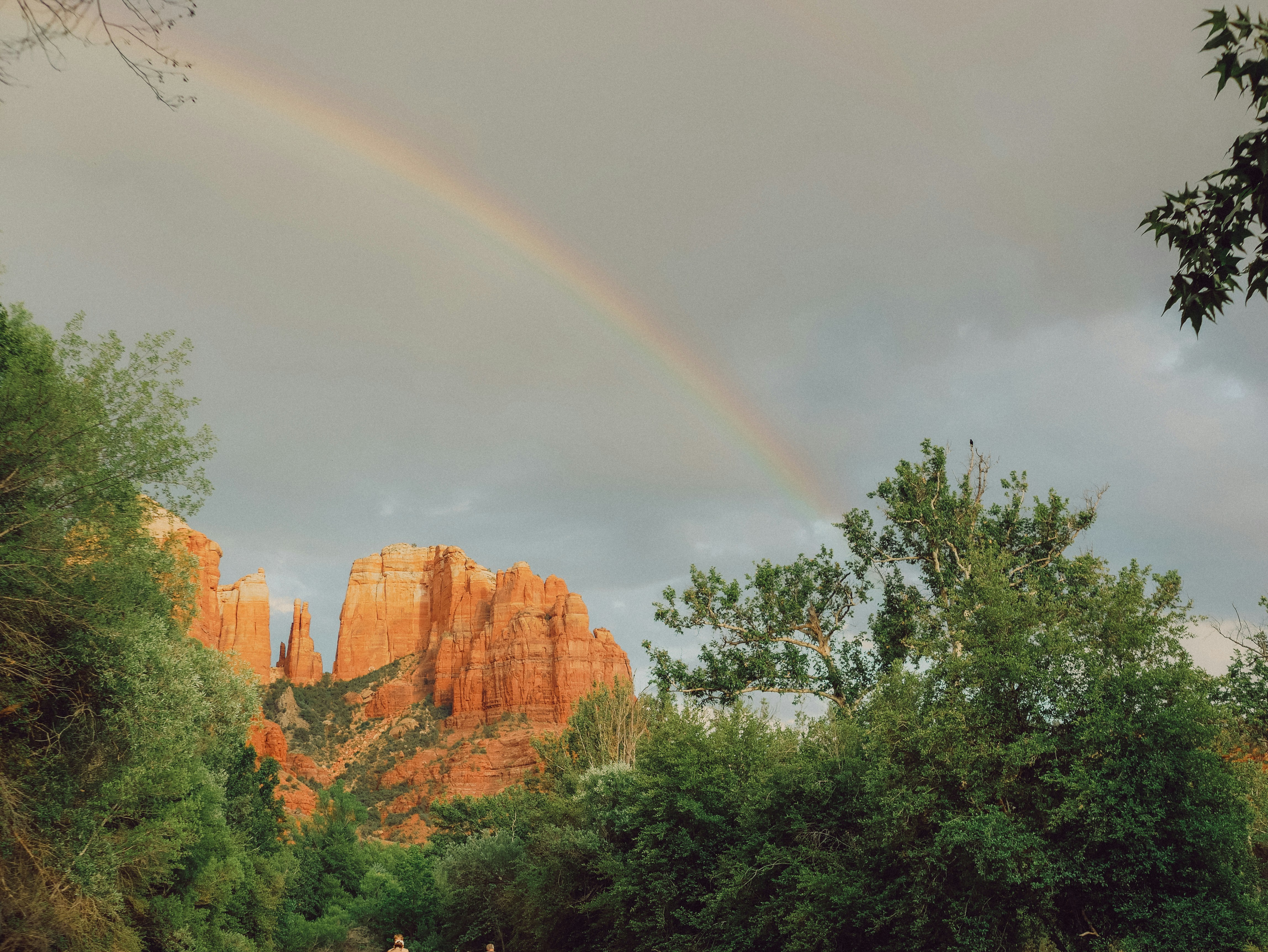 Golden Canyon Arc: A Rainbow Over Red Cliffs