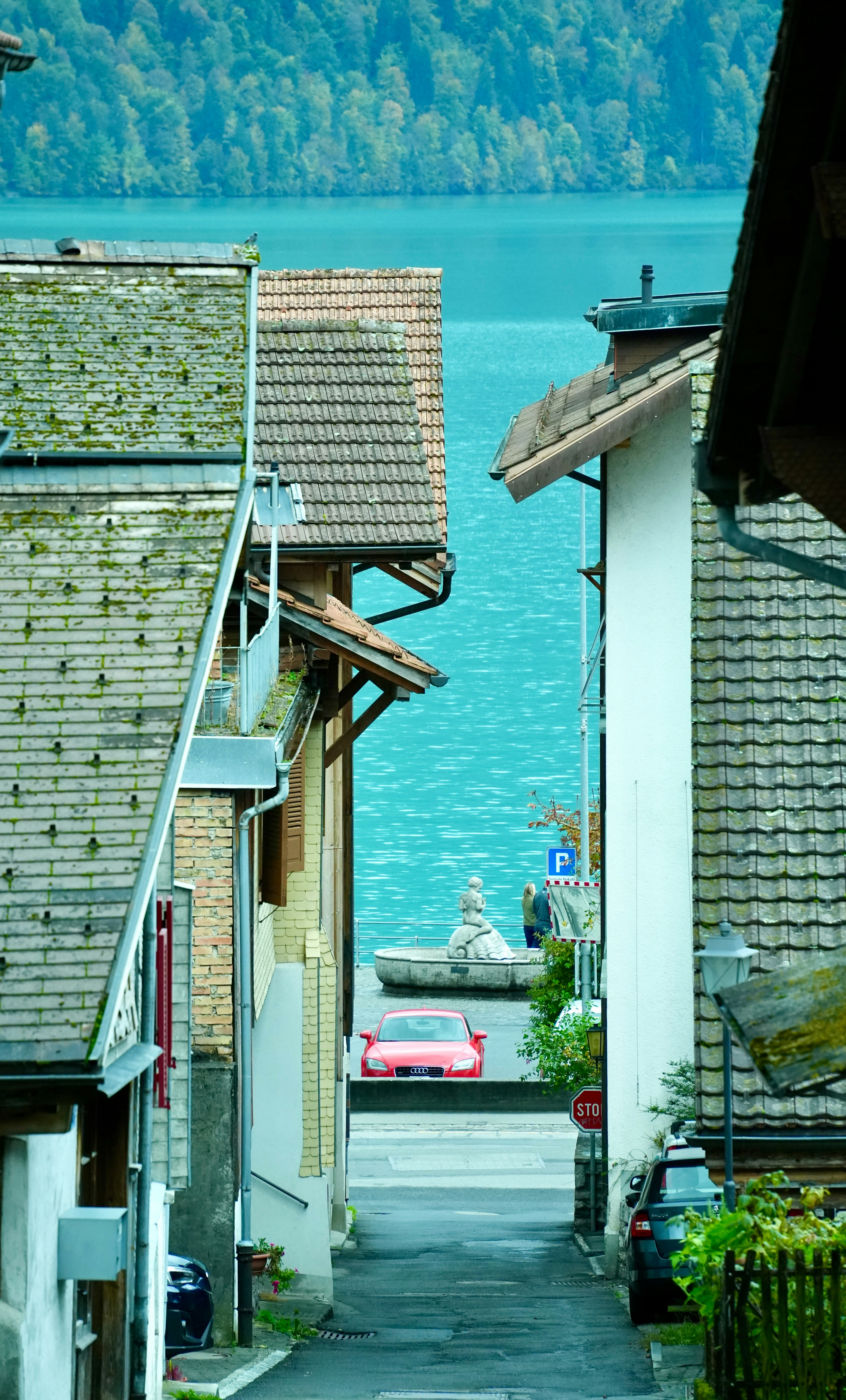 A Quiet Canal Framing the Waterfront Car