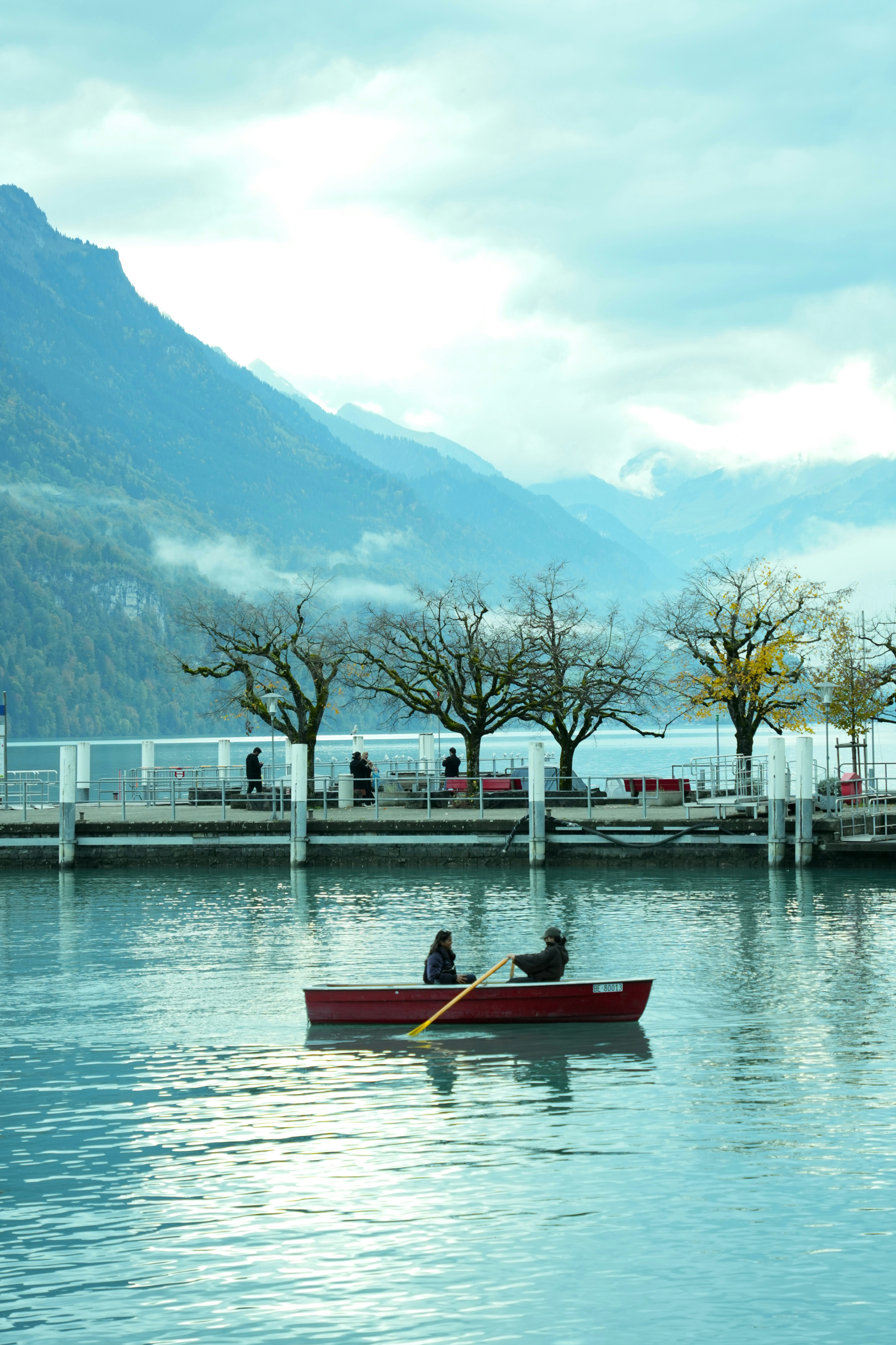 Red Rowboat on Serene Alpine Lake