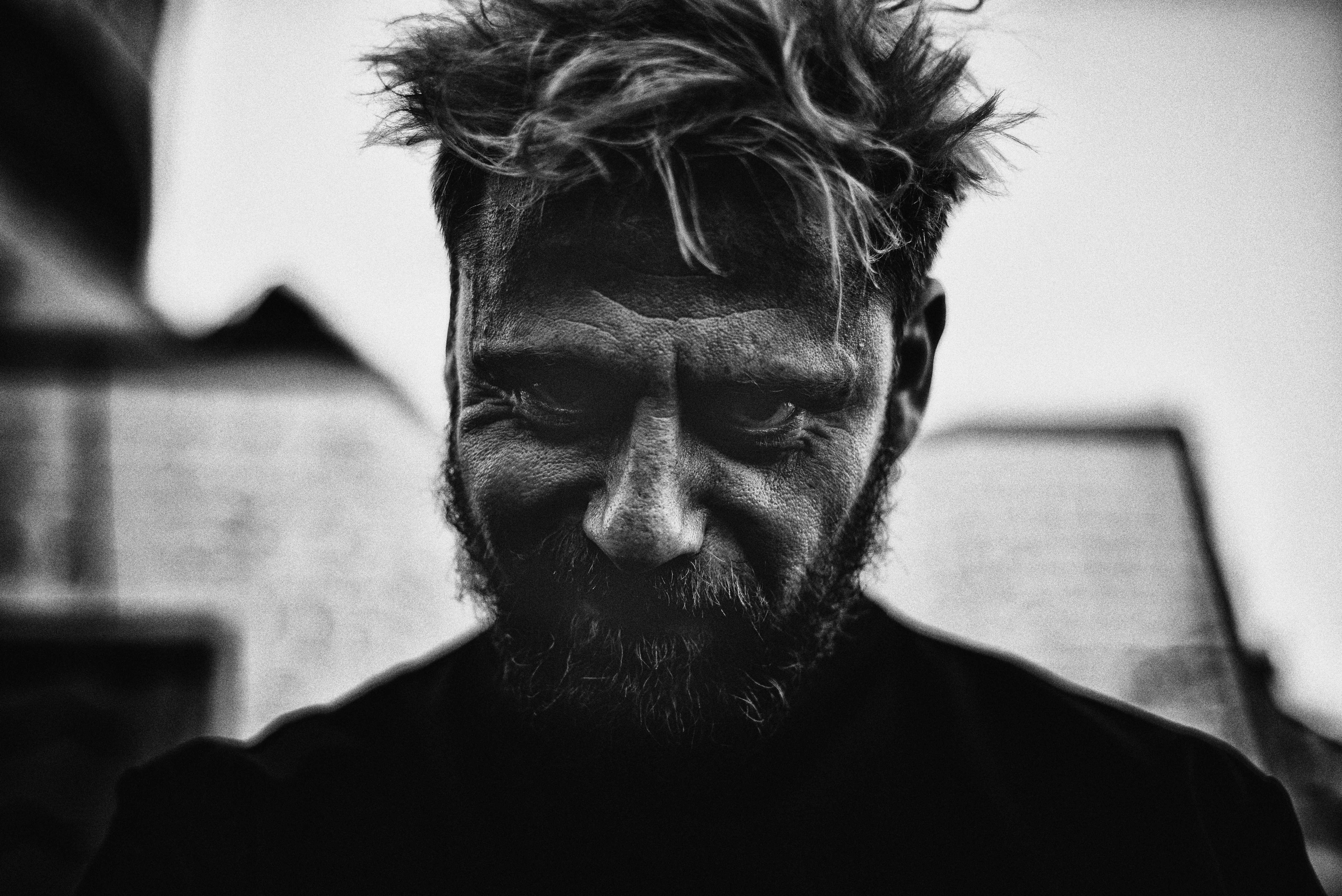 Shaded Intensity: A Gritty Portrait in High-Contrast Mono
