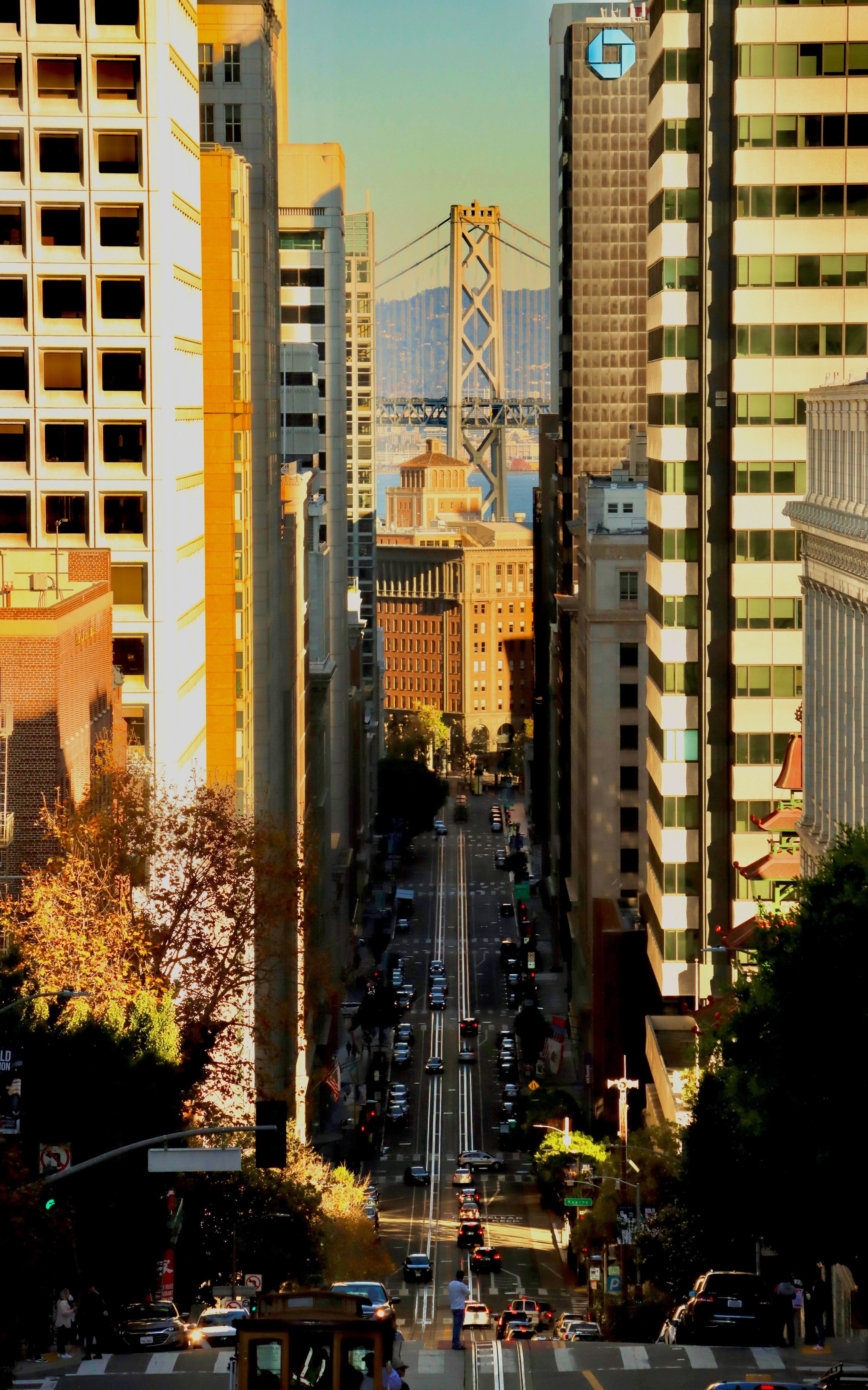 Urban Skyline Arc: A Sunlit Street Toward the Bay Bridge