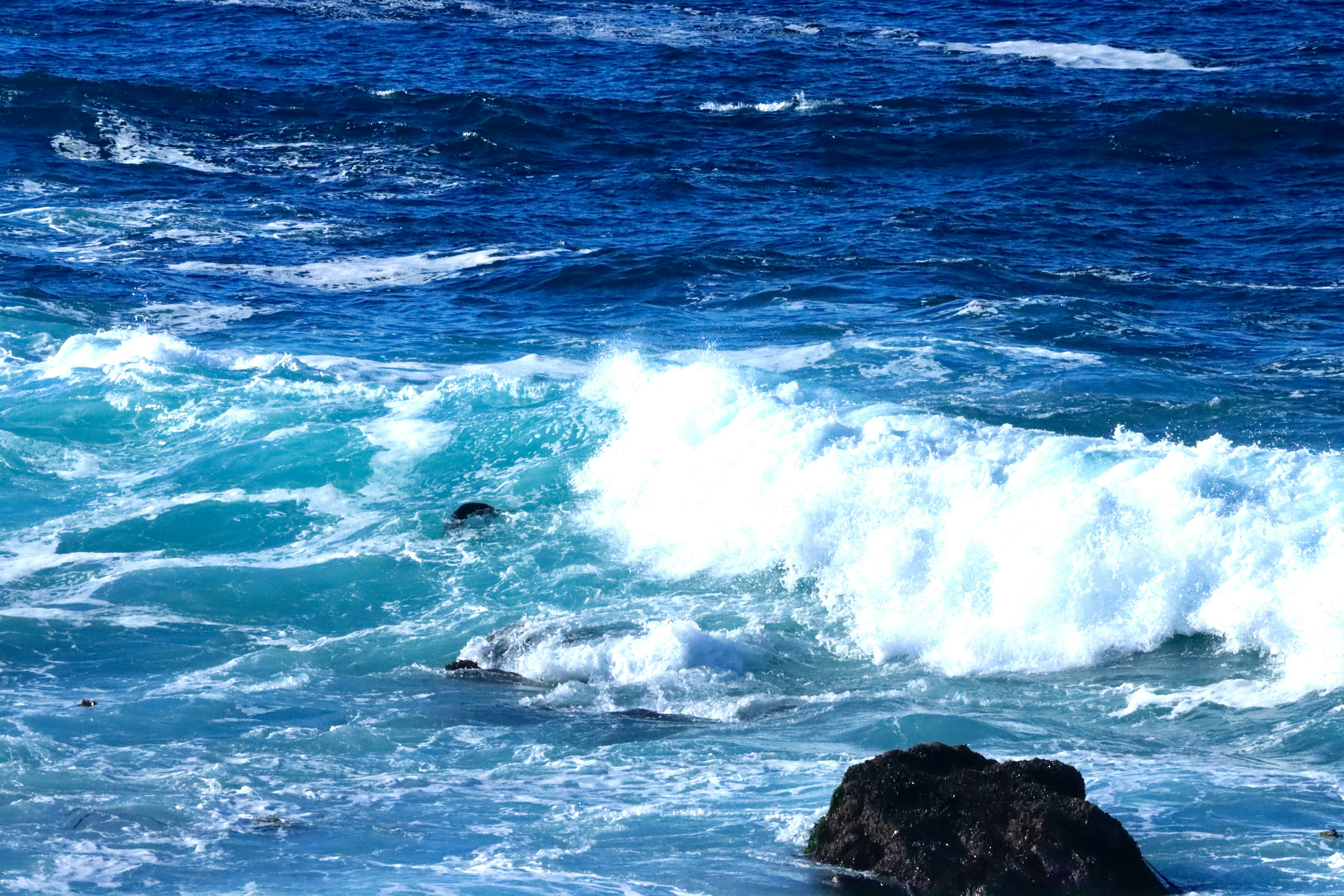 Breaking Atlantic Blues over a Rugged R coastline