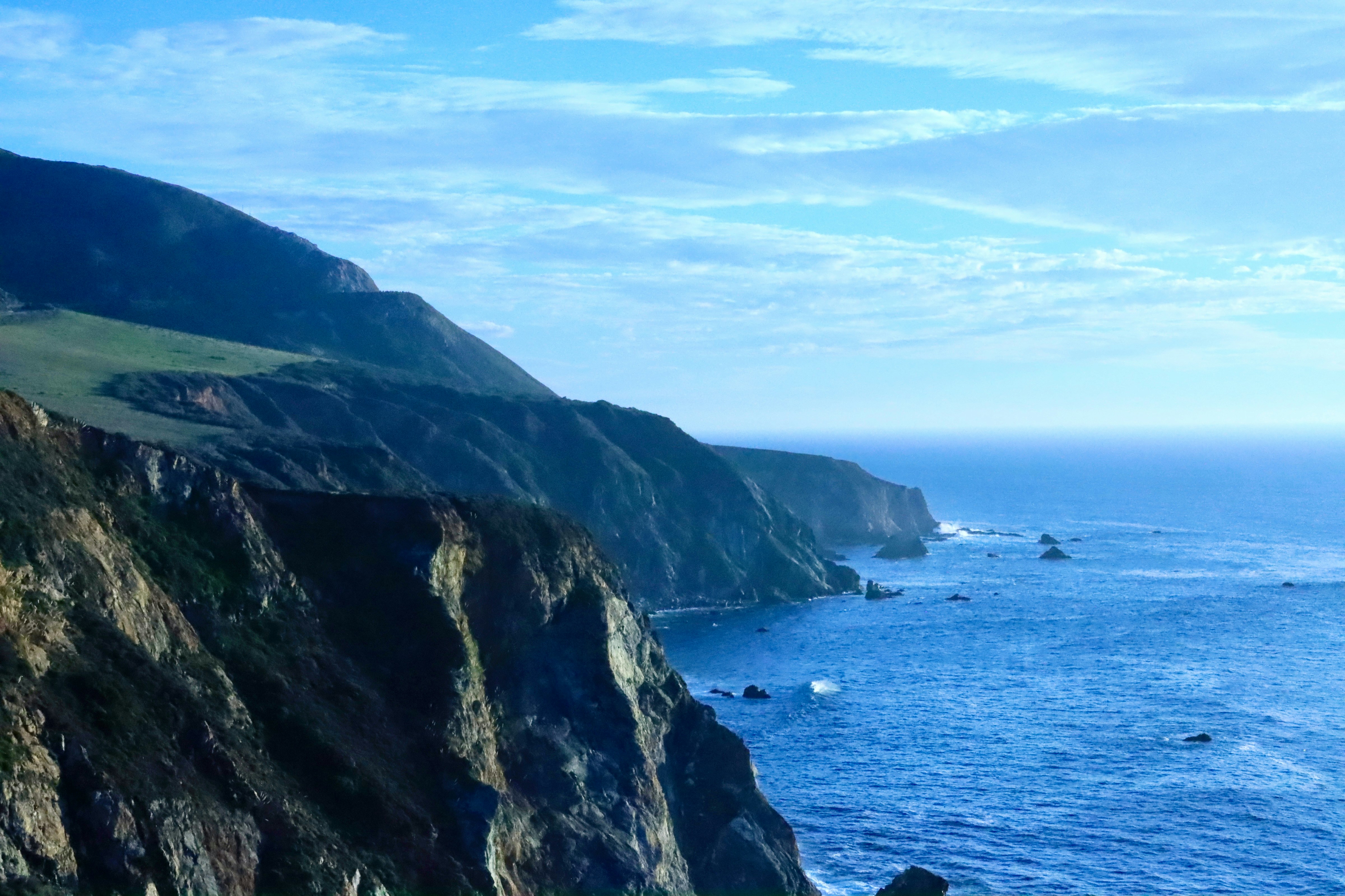 Cliffside Vista: Sunlit Atlantic Over Rugged Rocks