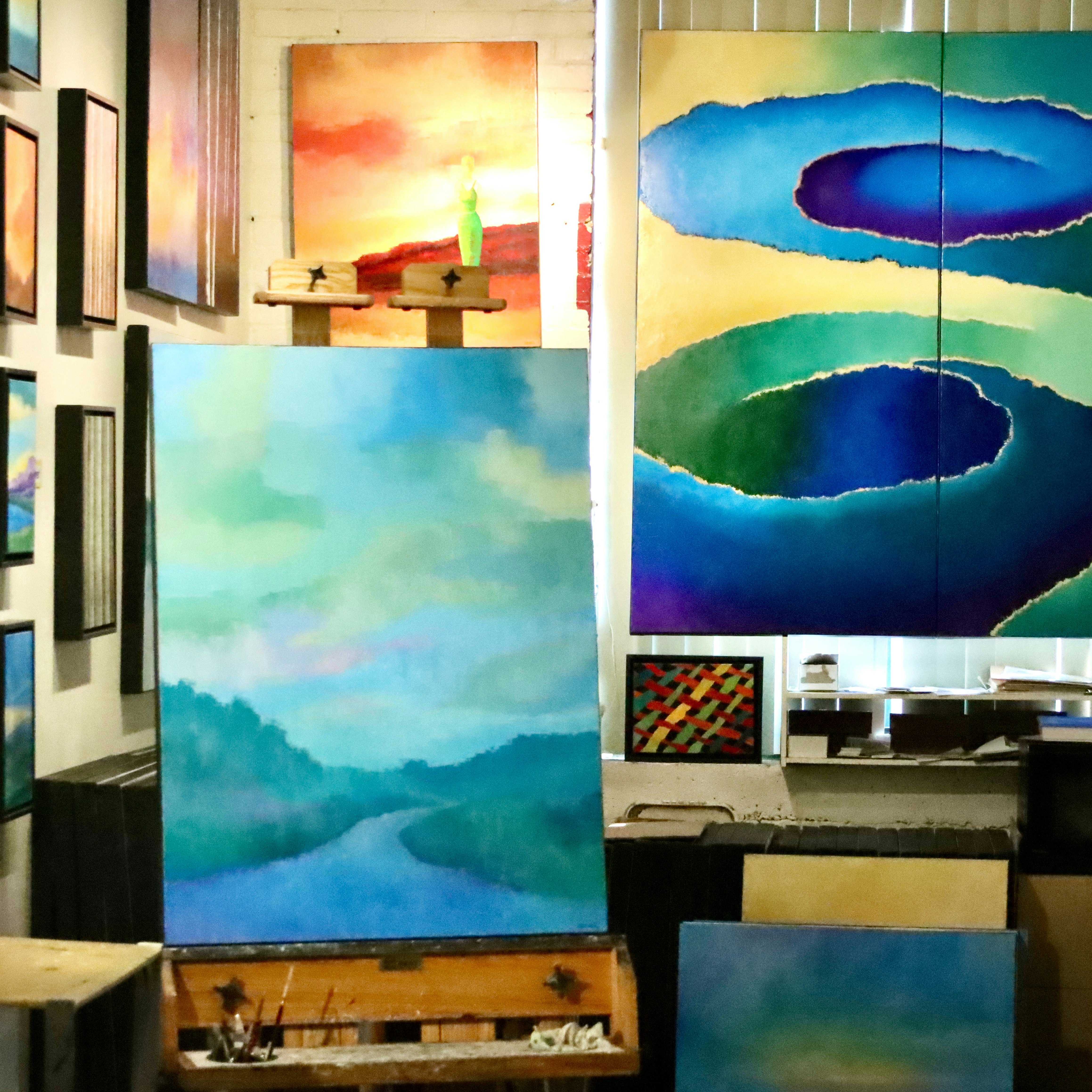 Shades of Serenity: Abstract canvases in a sunlit studio