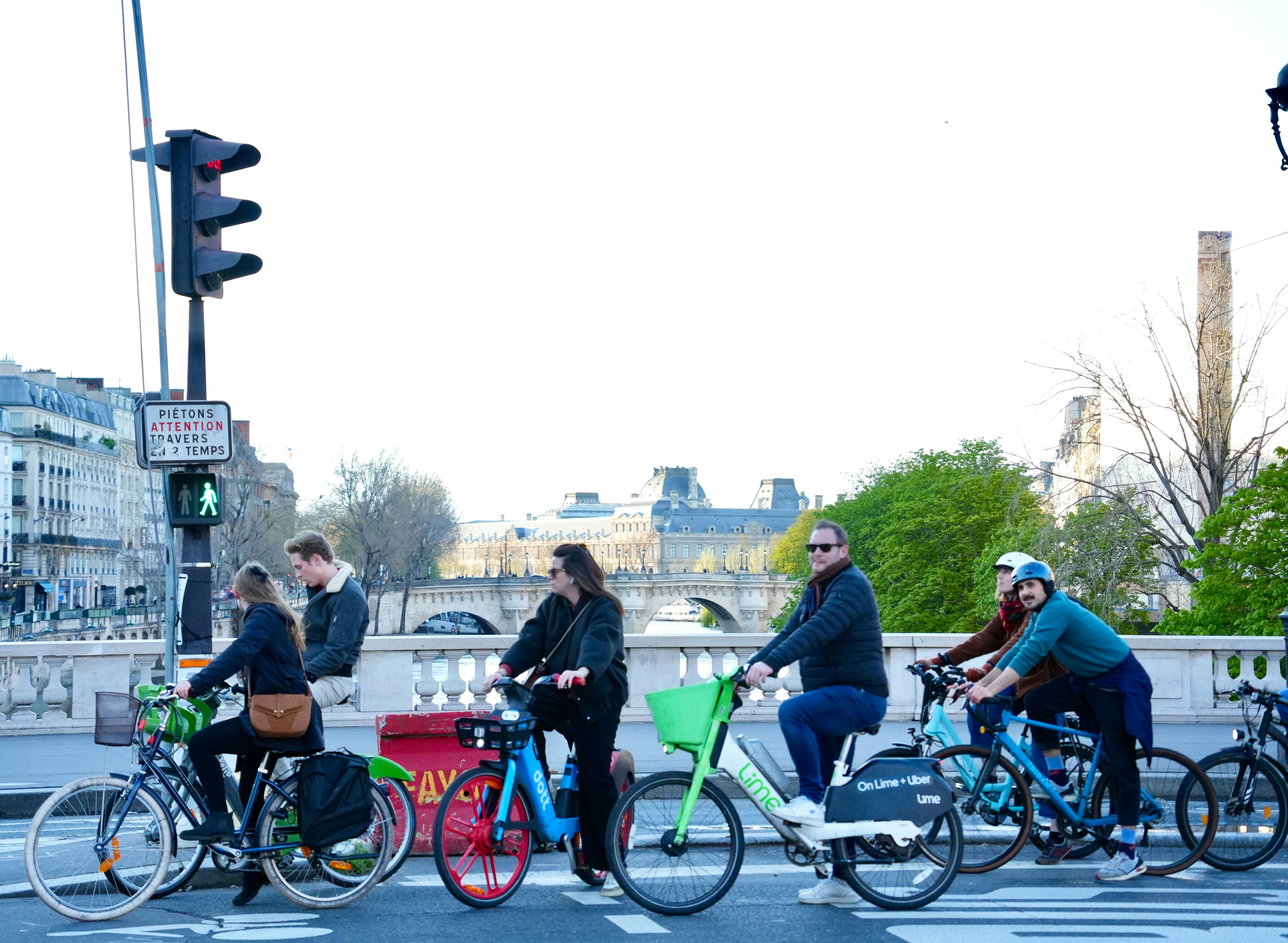Riders in Sequence: A Bright Line of Bicycles on a City Bridge