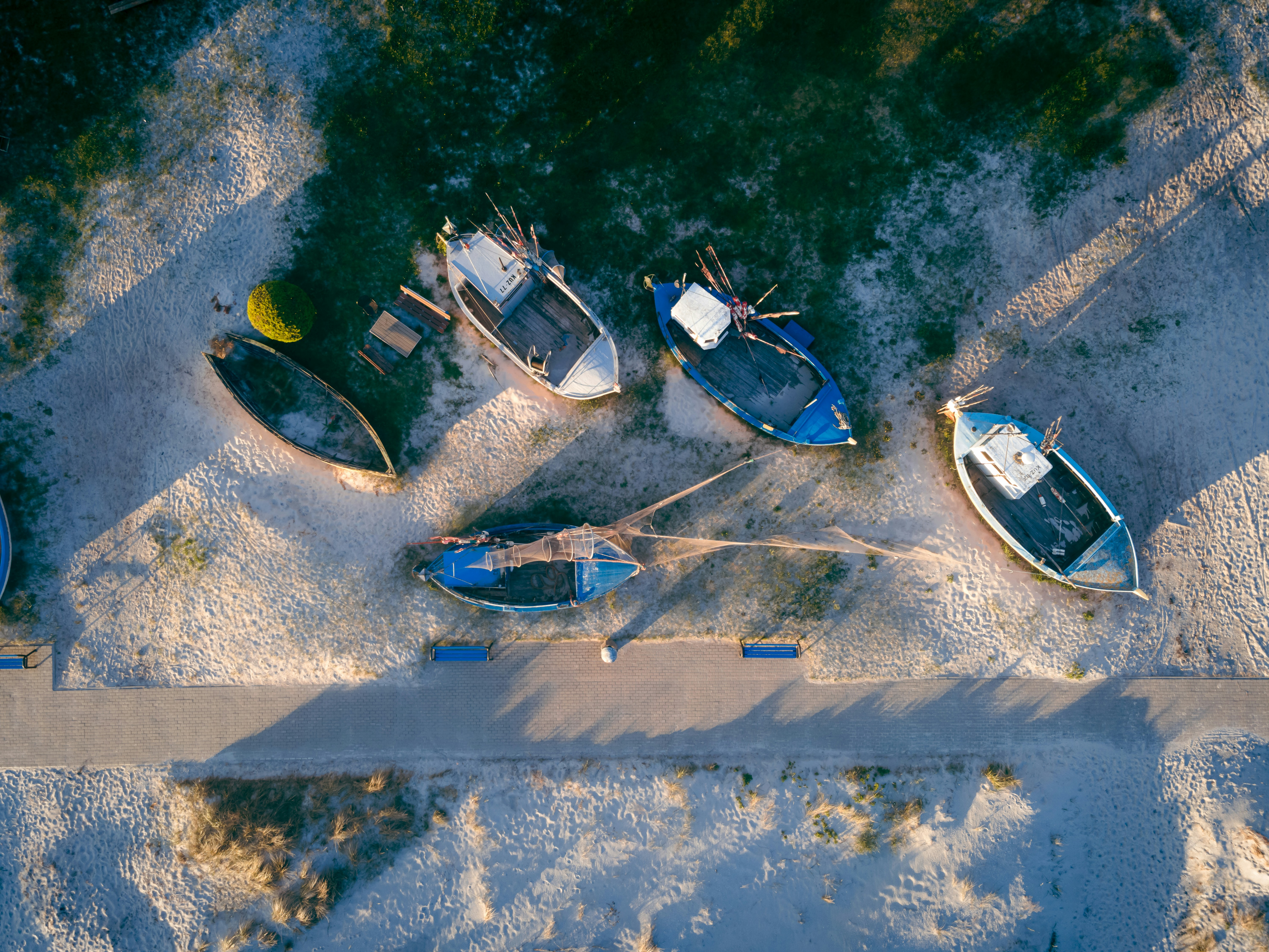 Beached Fleet from Above: Boats on a Pebble Shoreline