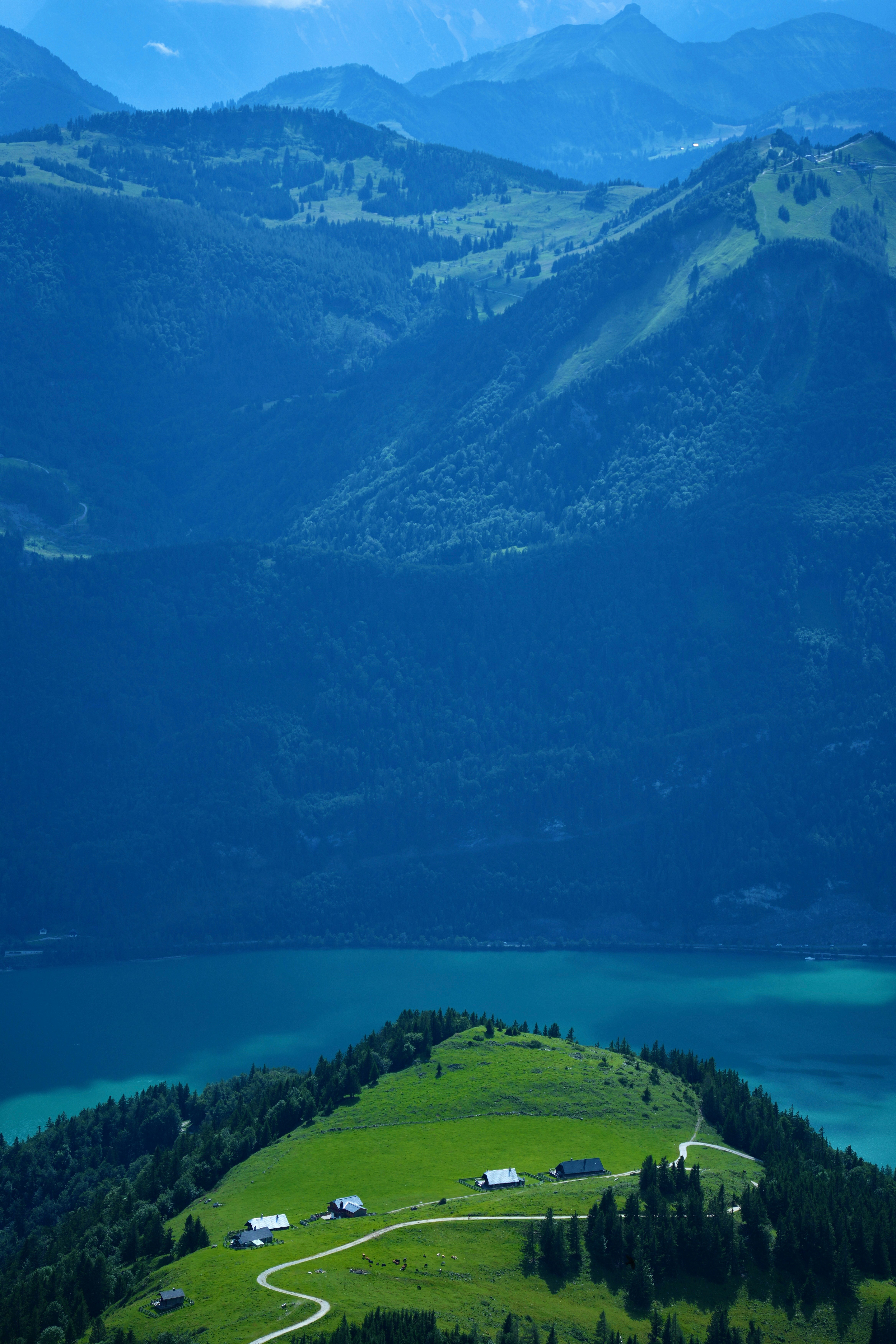 Blue Mist Over Alpine Village and Lake