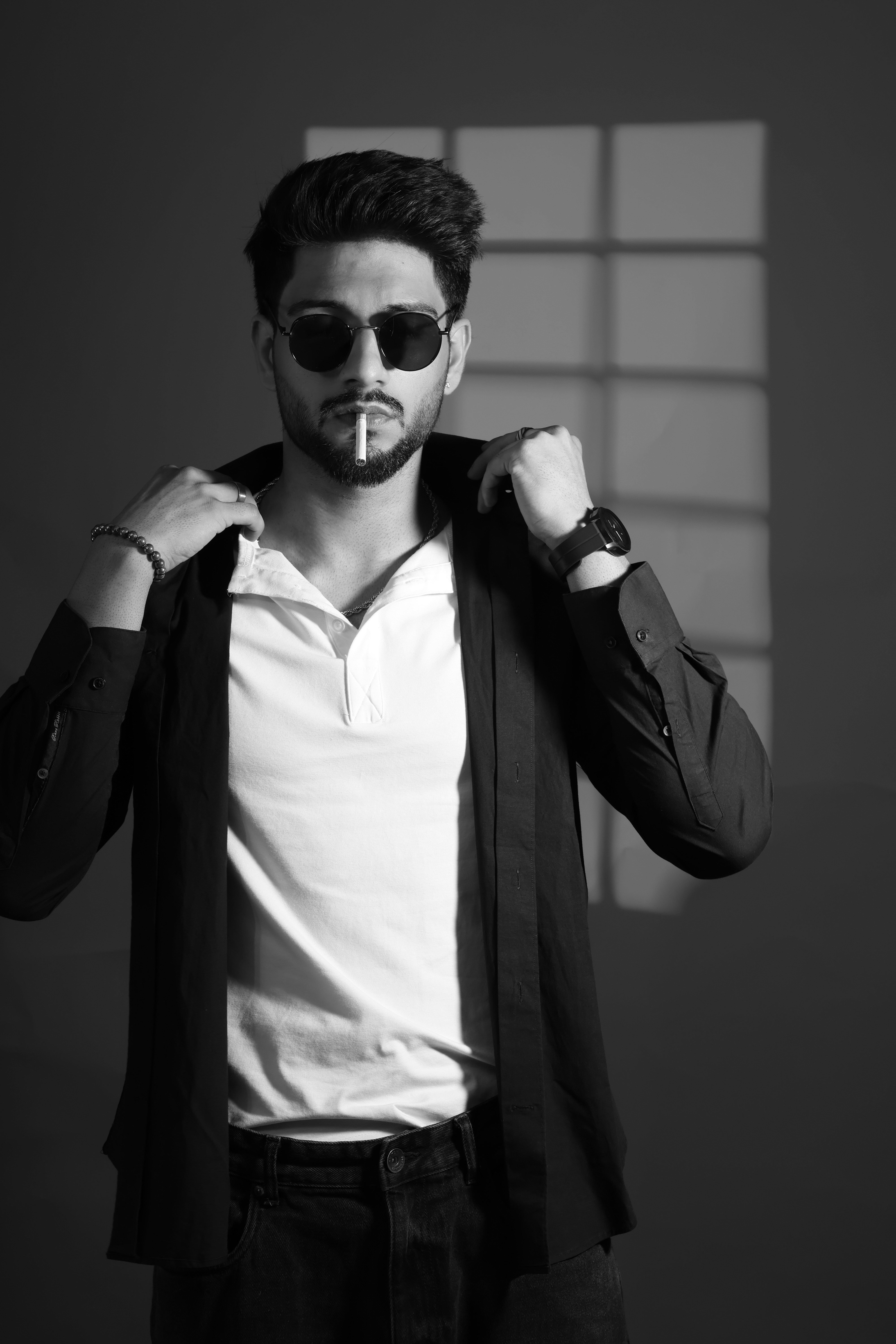 Shadowed Confidence: A Sunglassed Vibe with Cigarette Accent