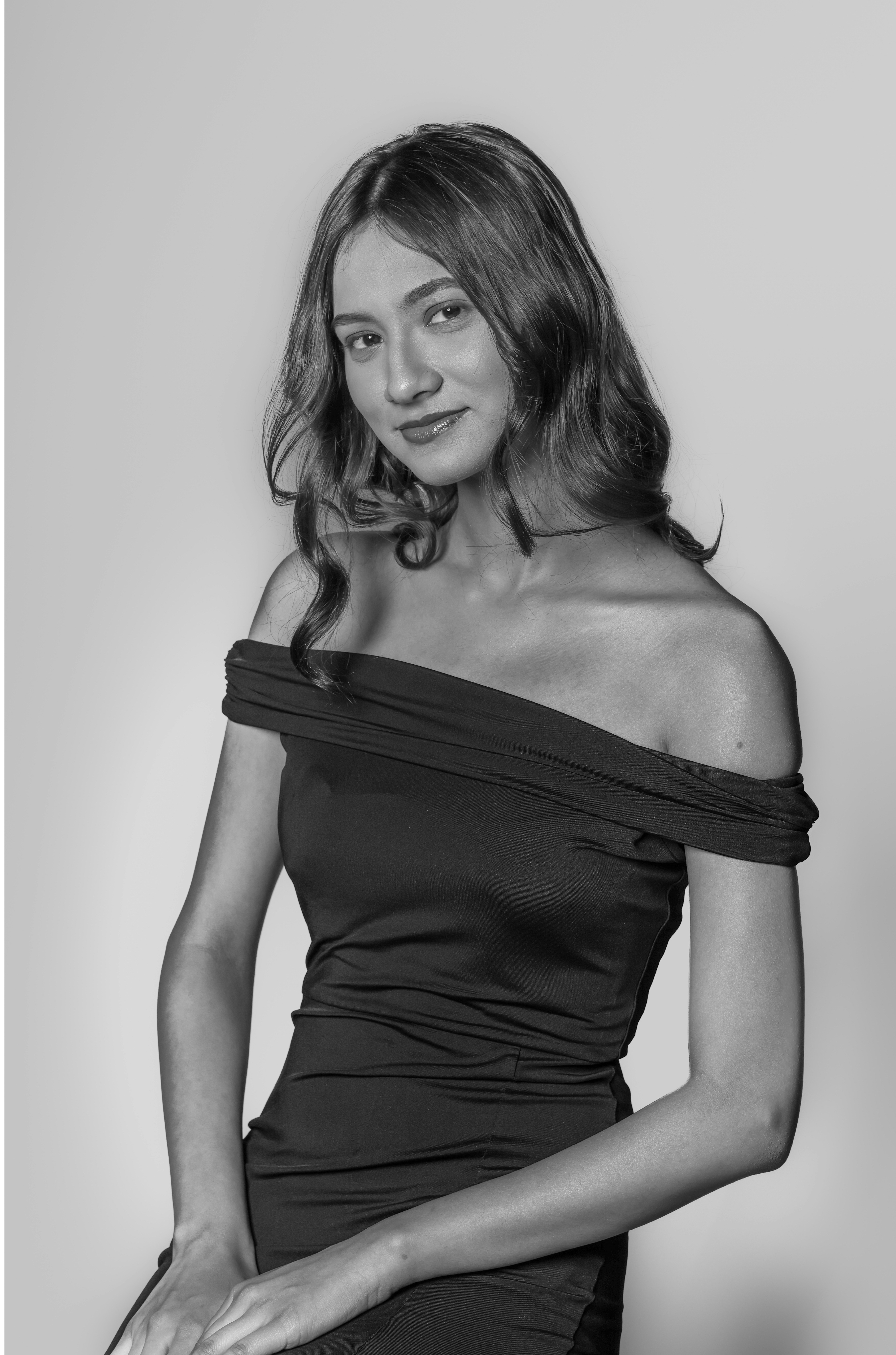 Graceful Off-Shoulder Pose in Monochrome Elegance