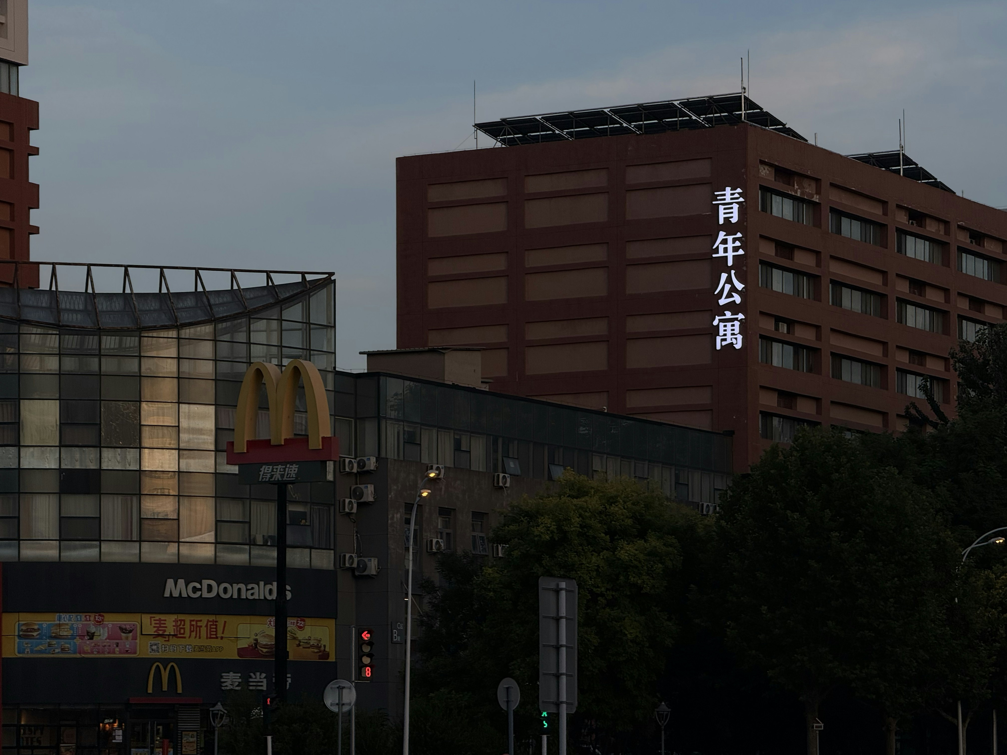 Neon Characters on a City Block: A Quiet Night at the McD Corner