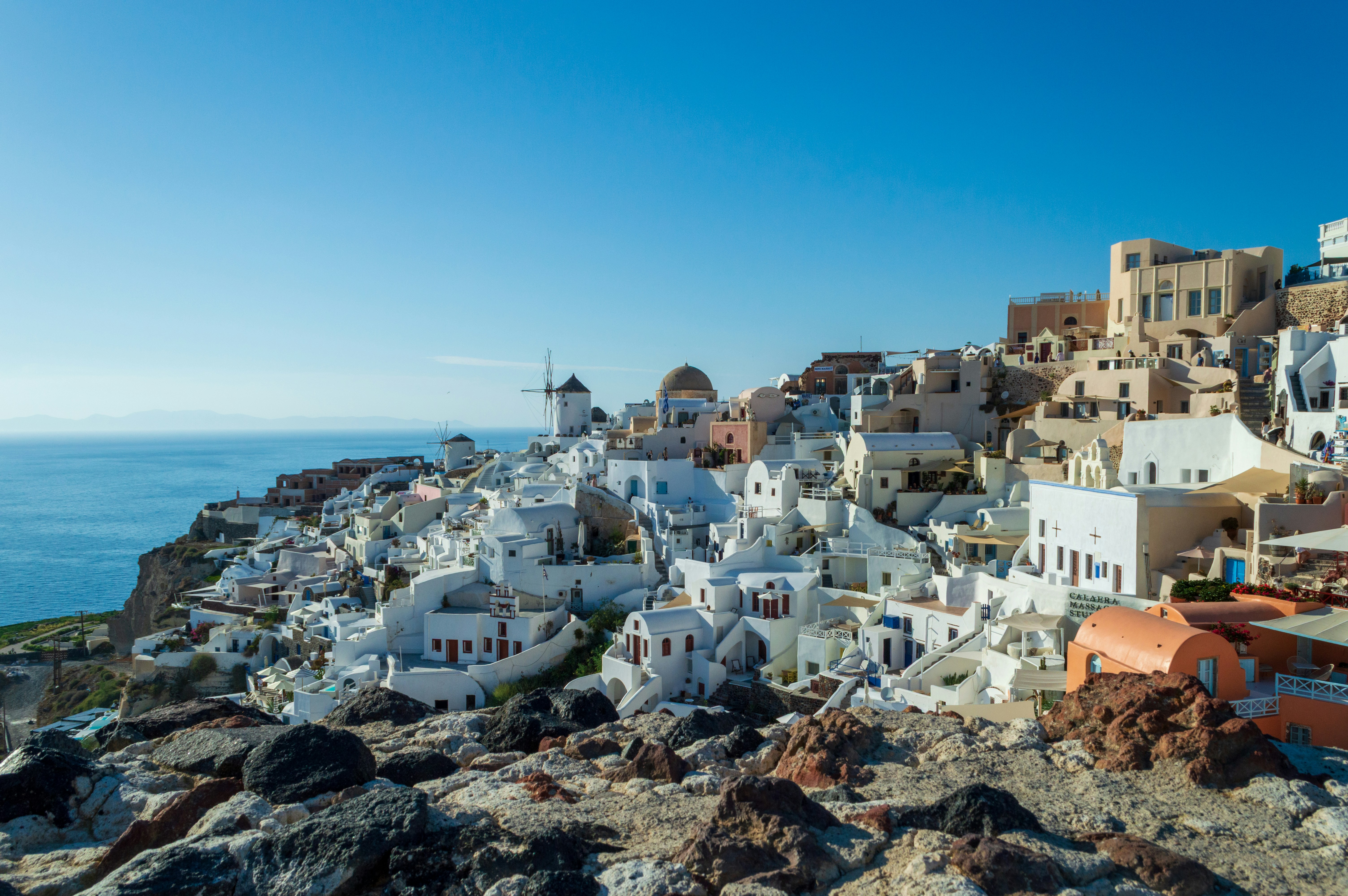 White-washed hillside village beneath a cobalt sky