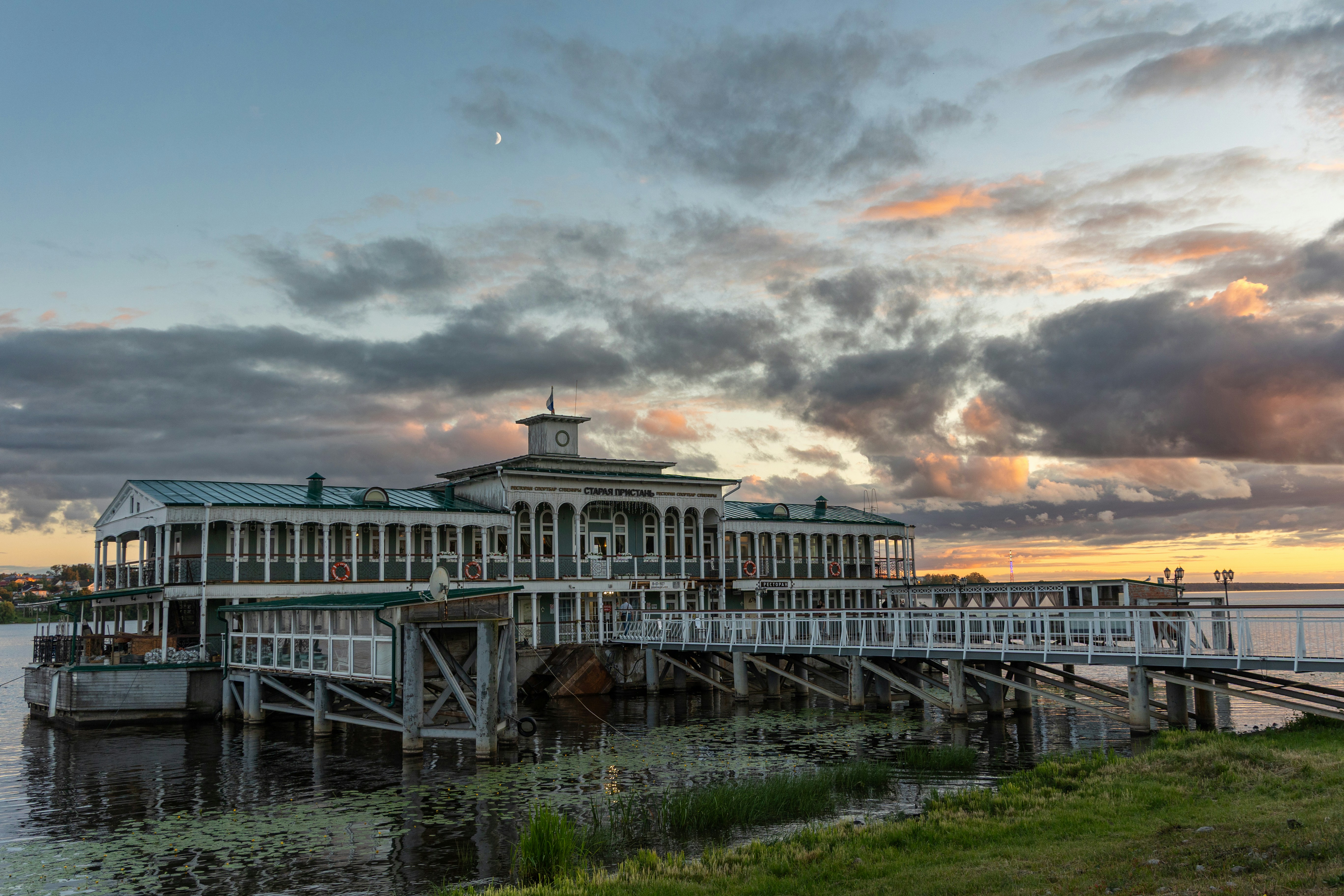 Sunset Pierhouse: A Historic Waterfront Structure Bathed in Evening Light