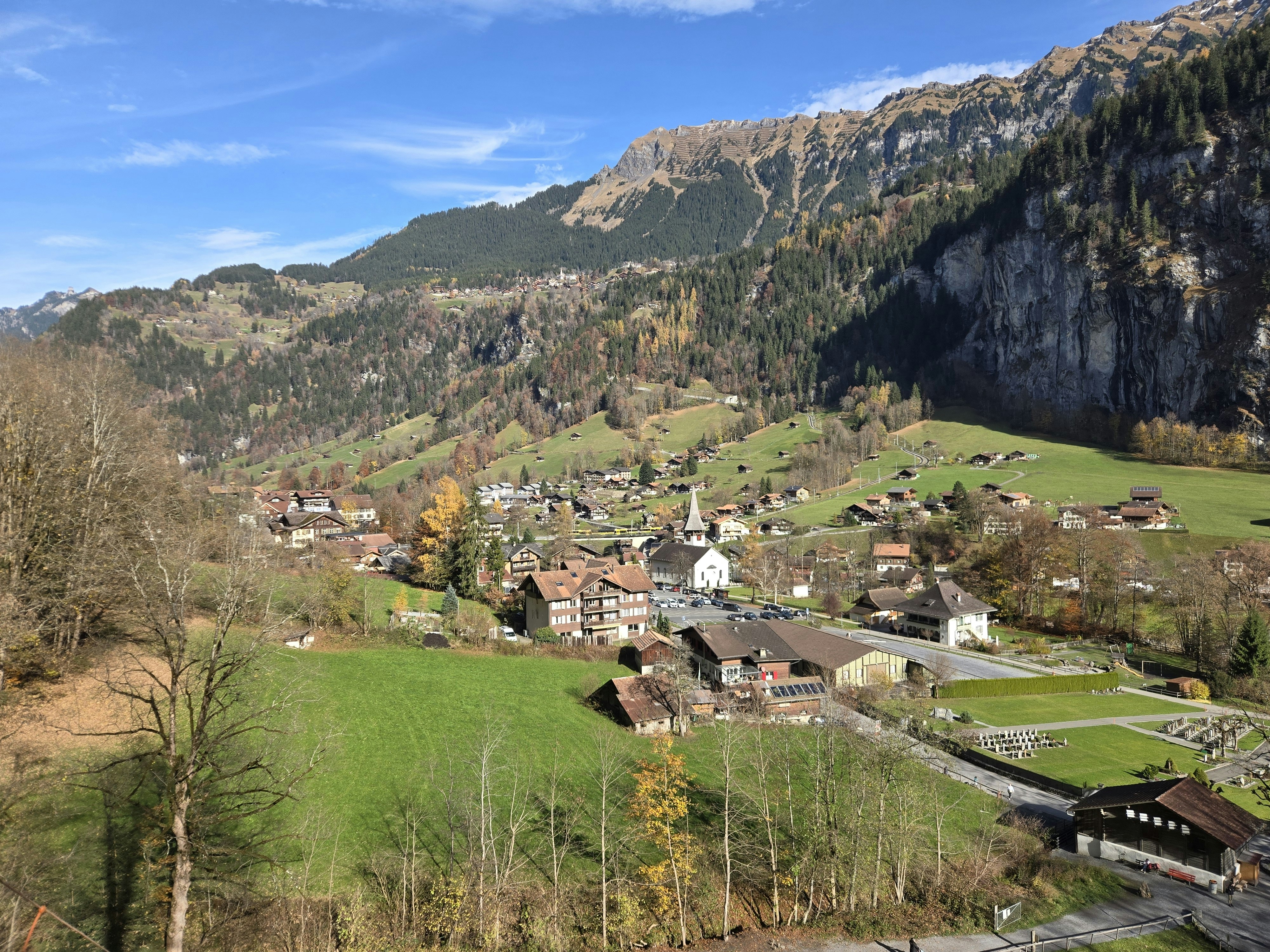 A picturesque village nestled in a lush mountain valley.