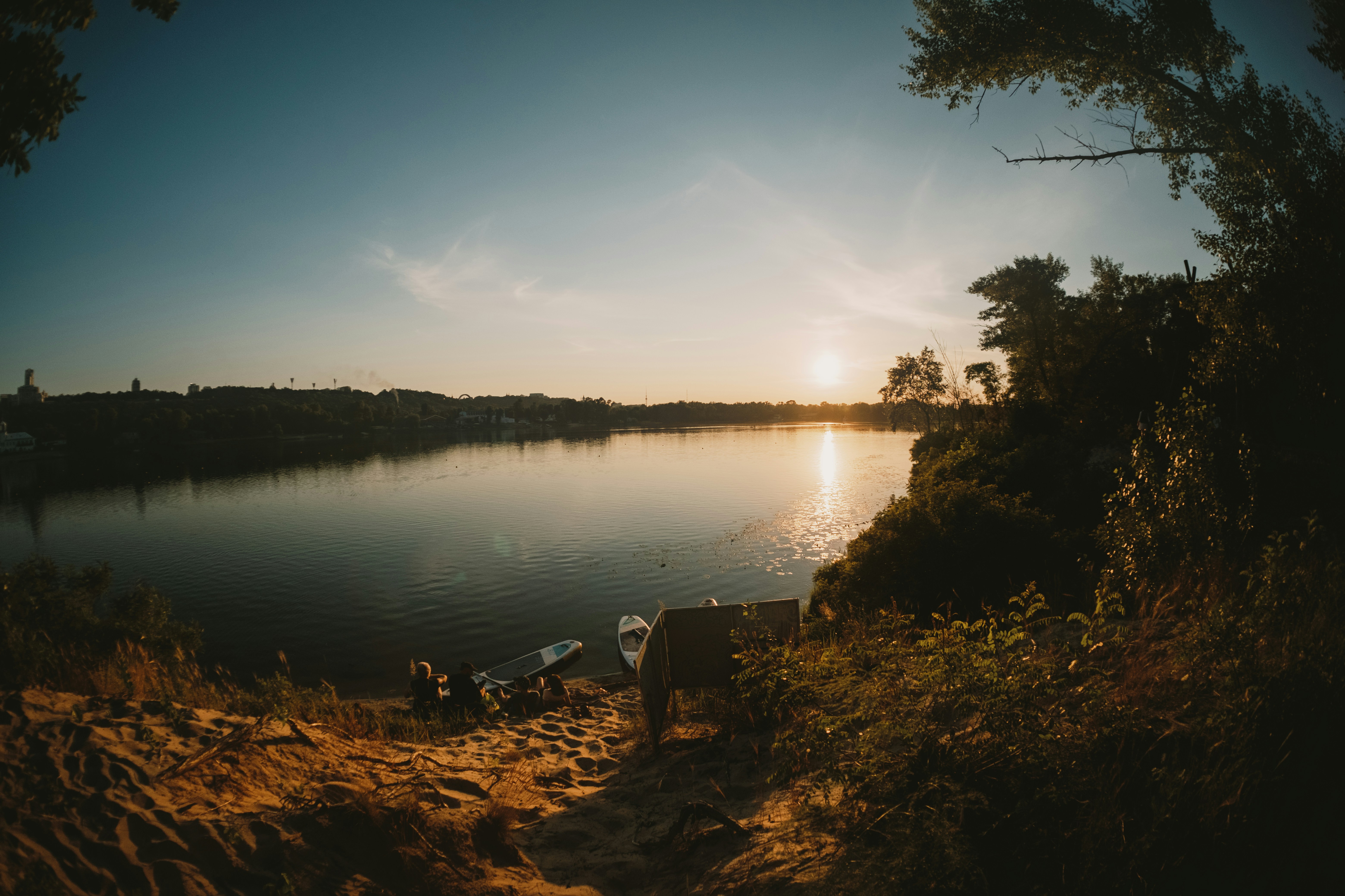 Dawn on the Riverbank: Boats Rest at the Quiet Shore