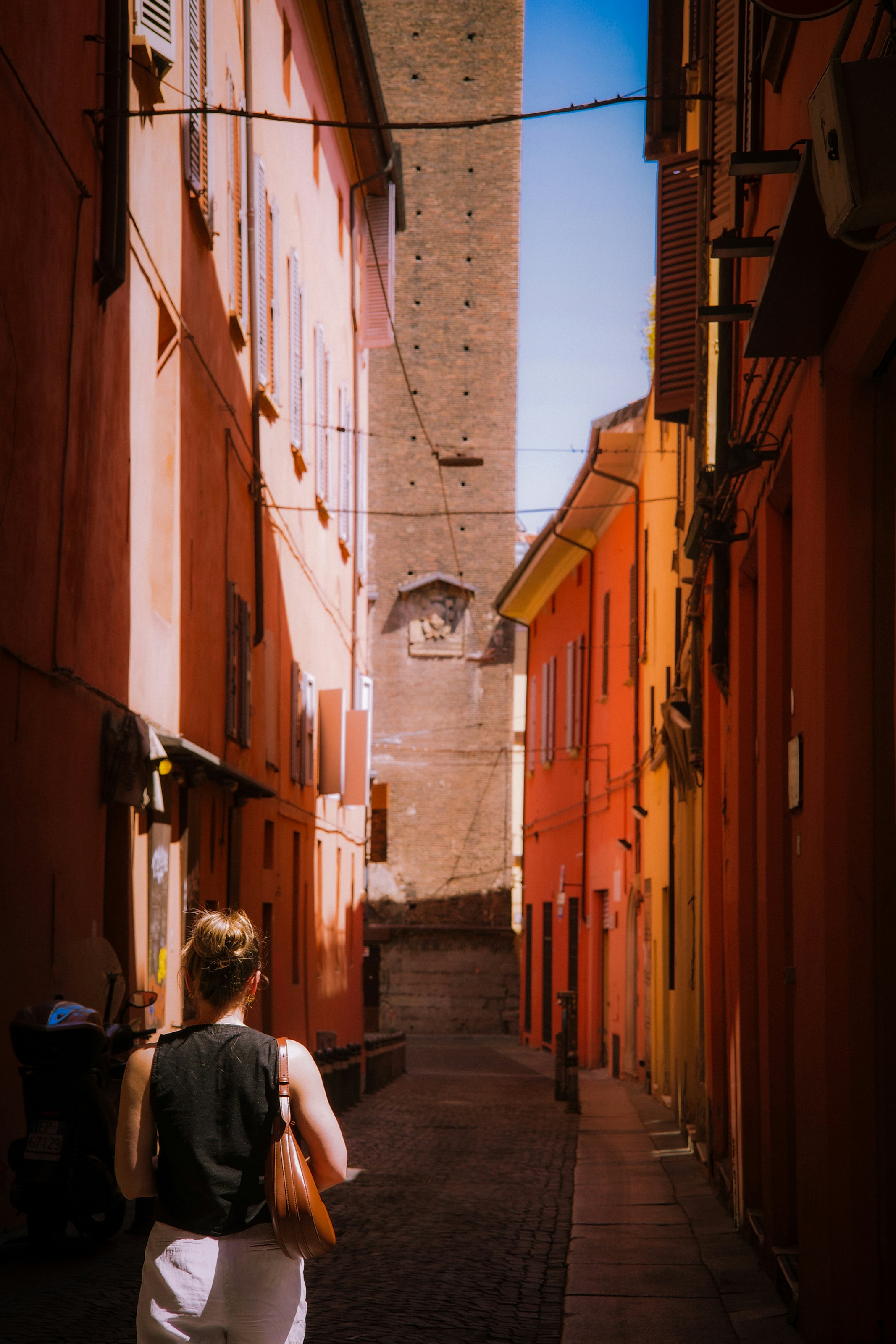 Morning in a Sunlit Old Quarter: A Solo Traveler in a Narrow Cairn of Color