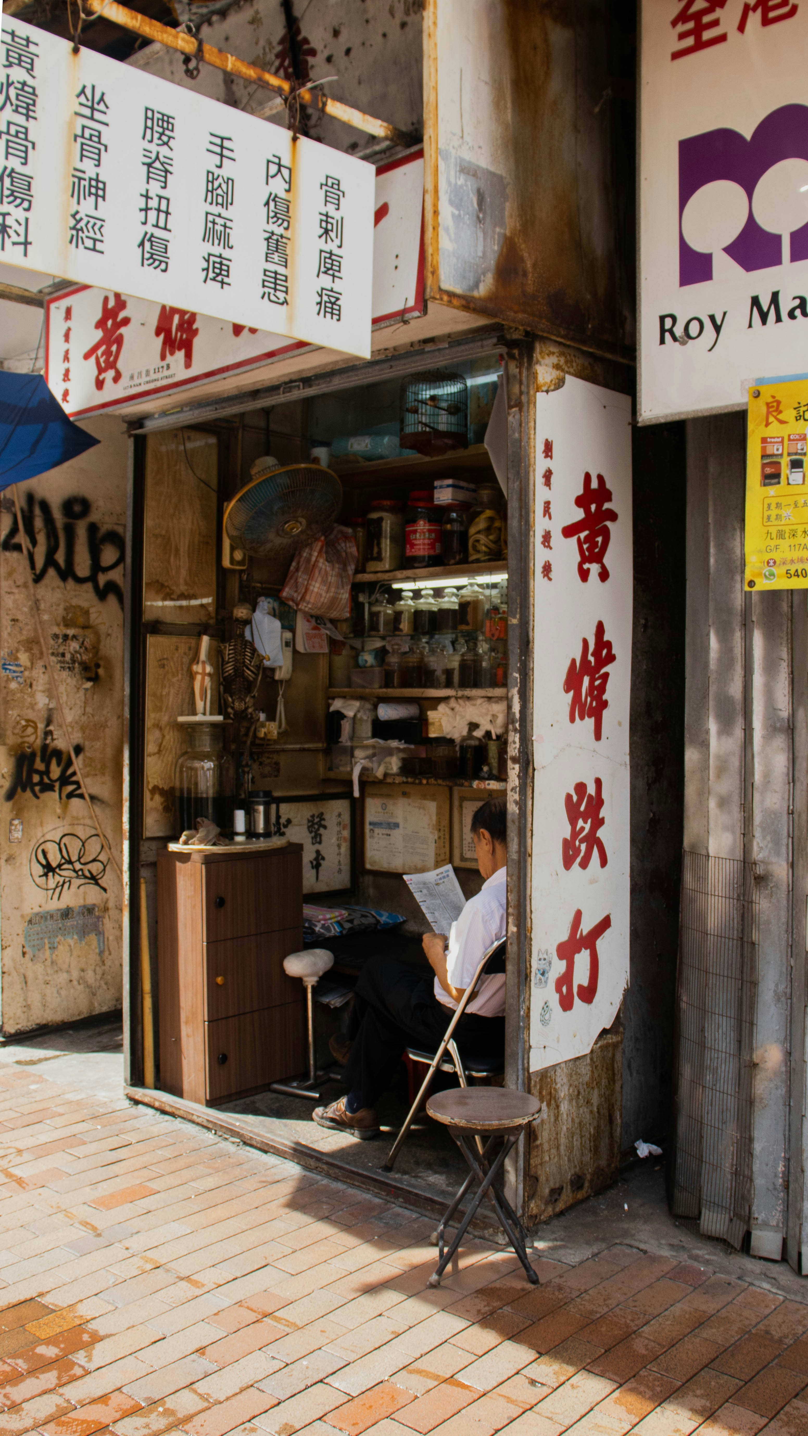 Neon Signage and Small Shopfront: A Quiet Moment Inside a City Medical Shop