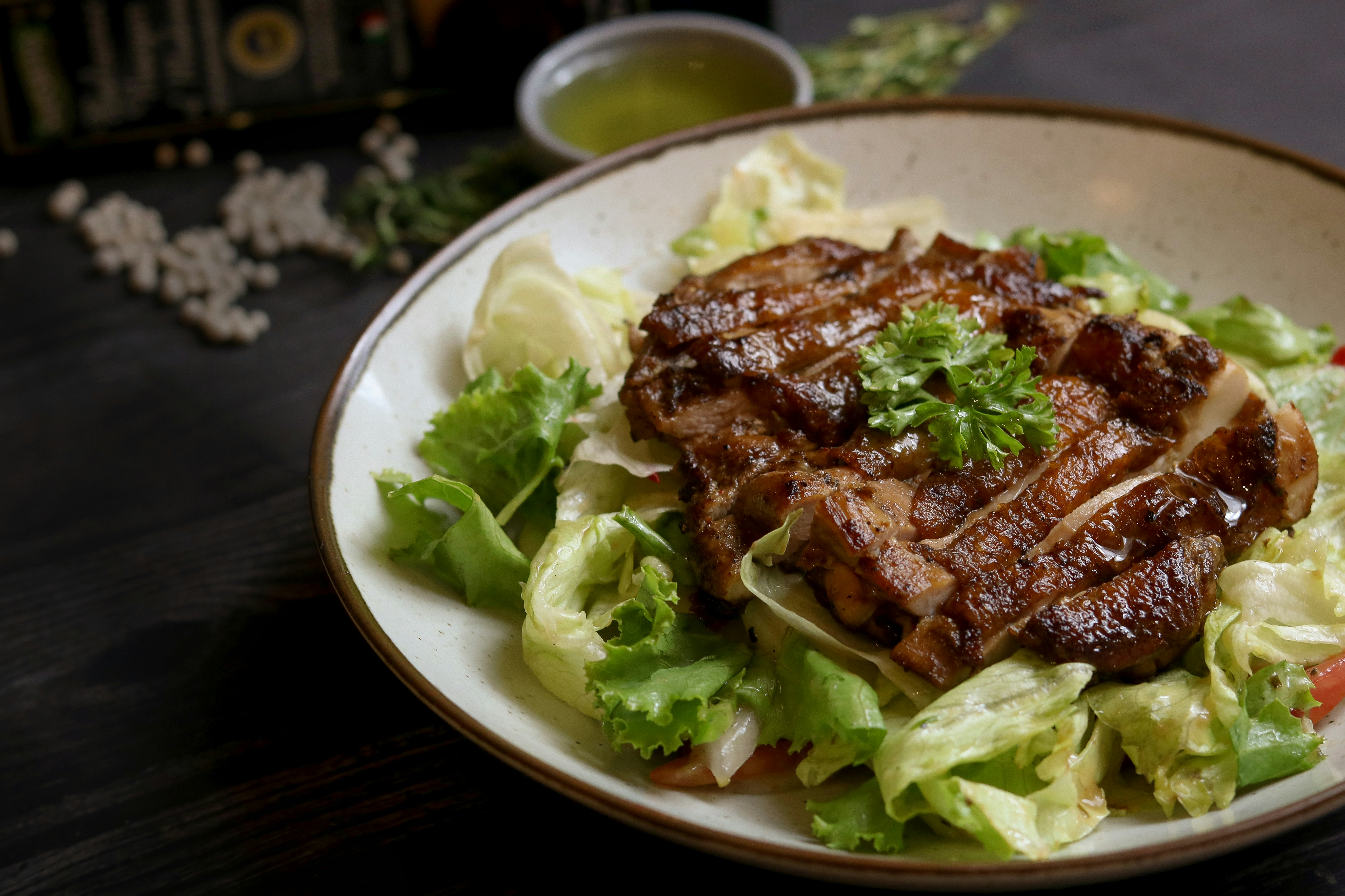Charred Pork over Crisp Lettuce: A Plate of Savory Greens and Glazed Richness