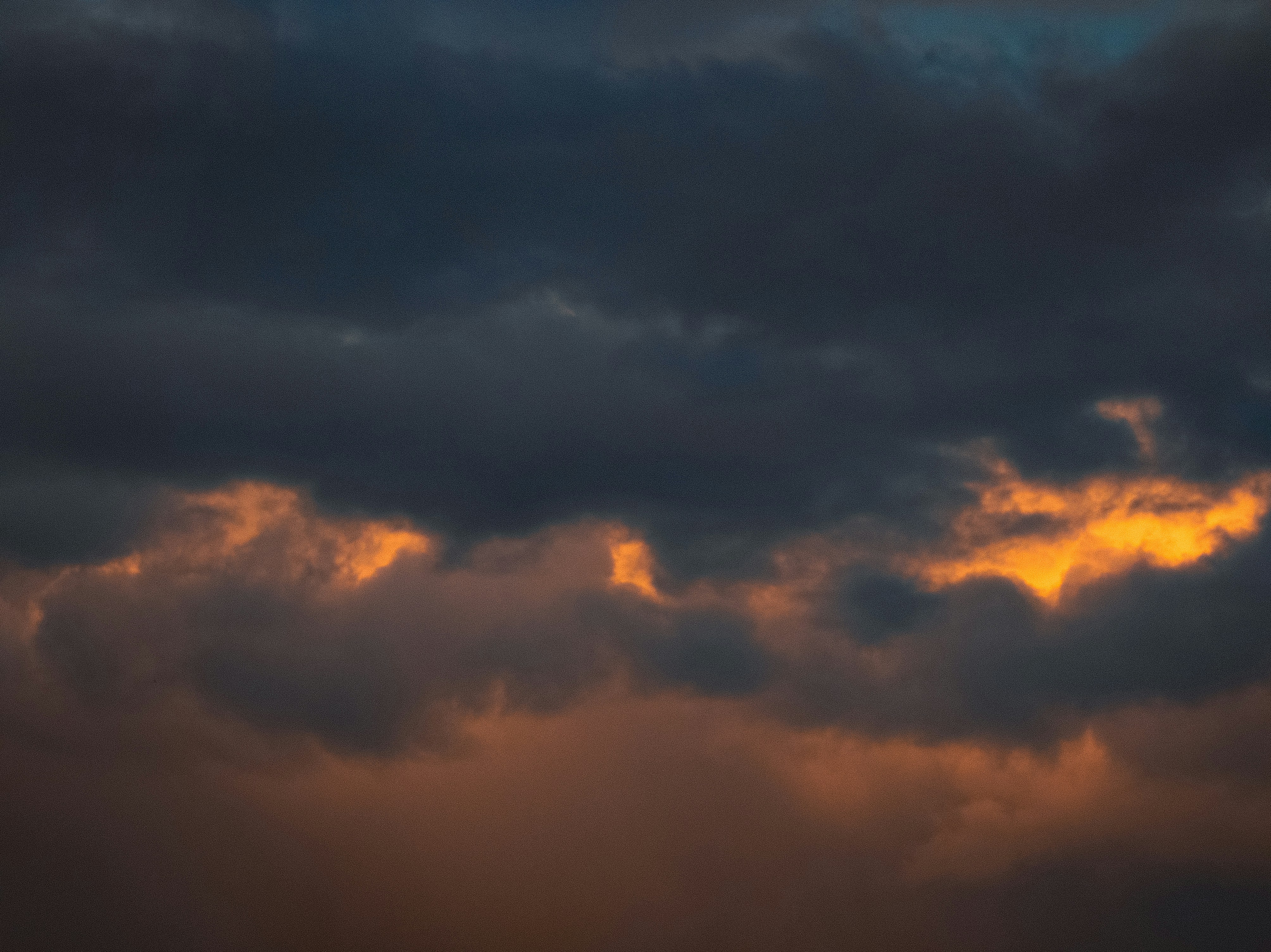 Golden Edge of Dusk: Clouds Whisper the Last Light