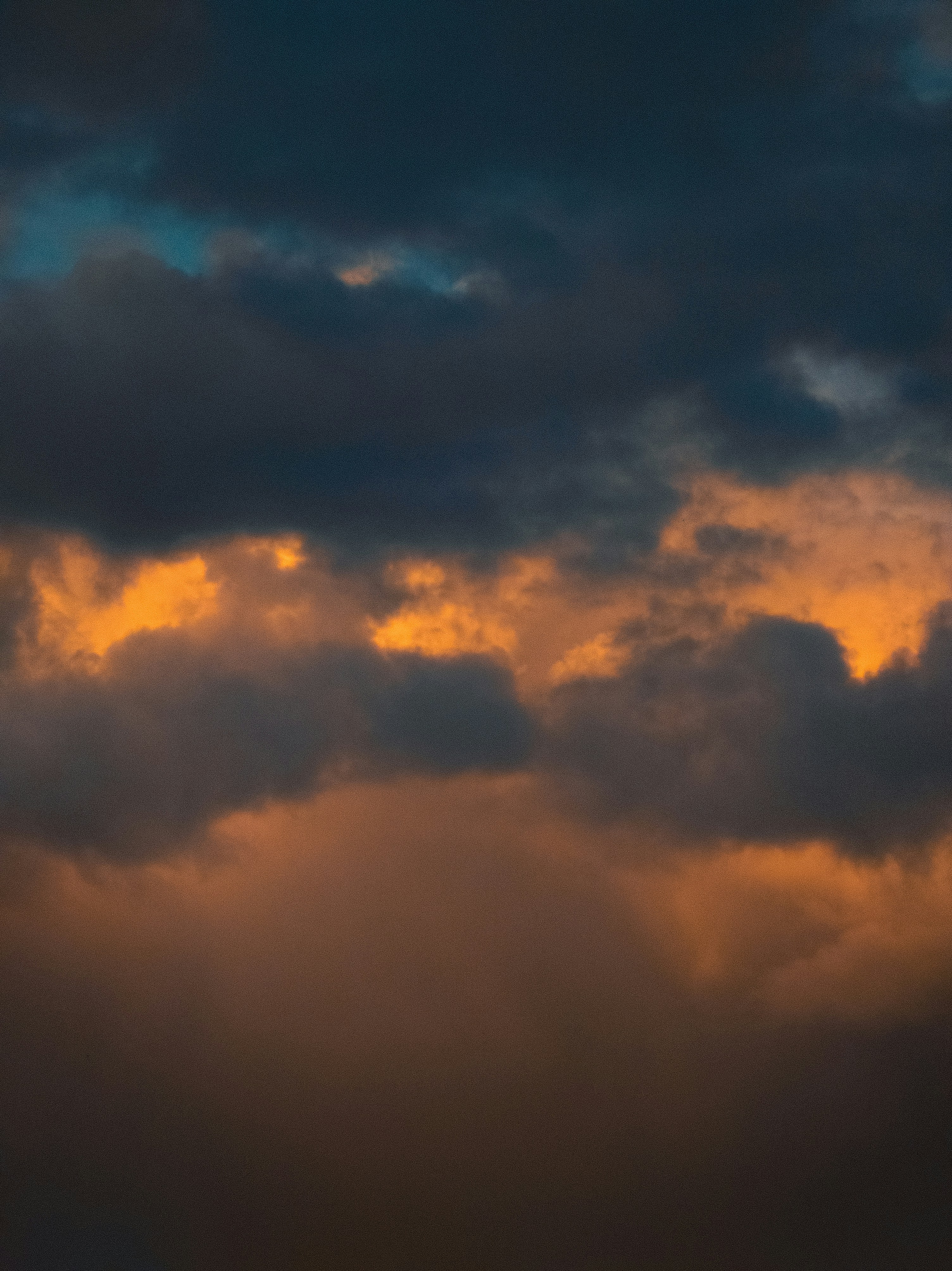 Dusk Fire in the Clouds: Warm Edges Against a Velvet Sky
