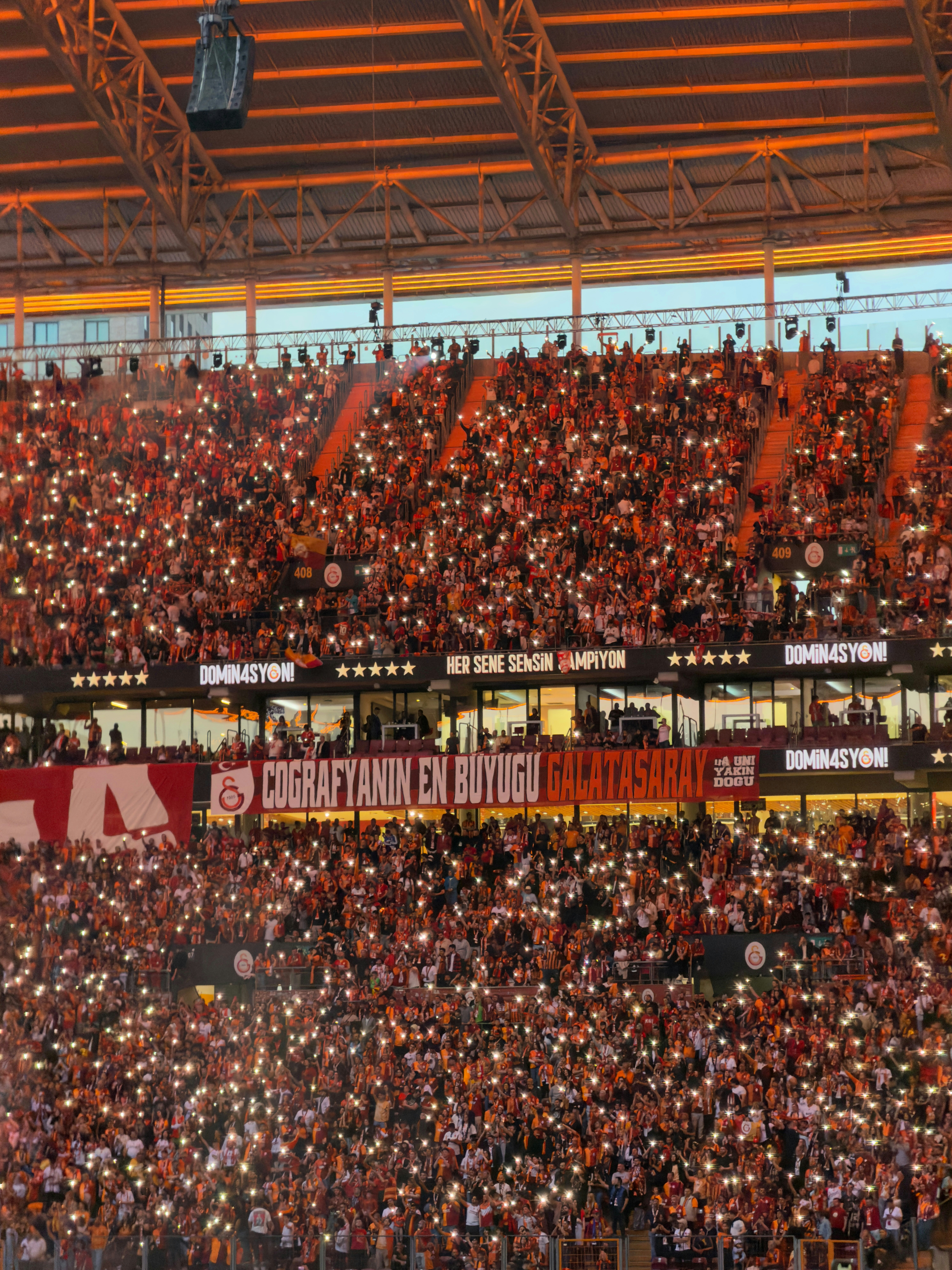 Crowd of Fans Igniting the Stadium with Phone Lights