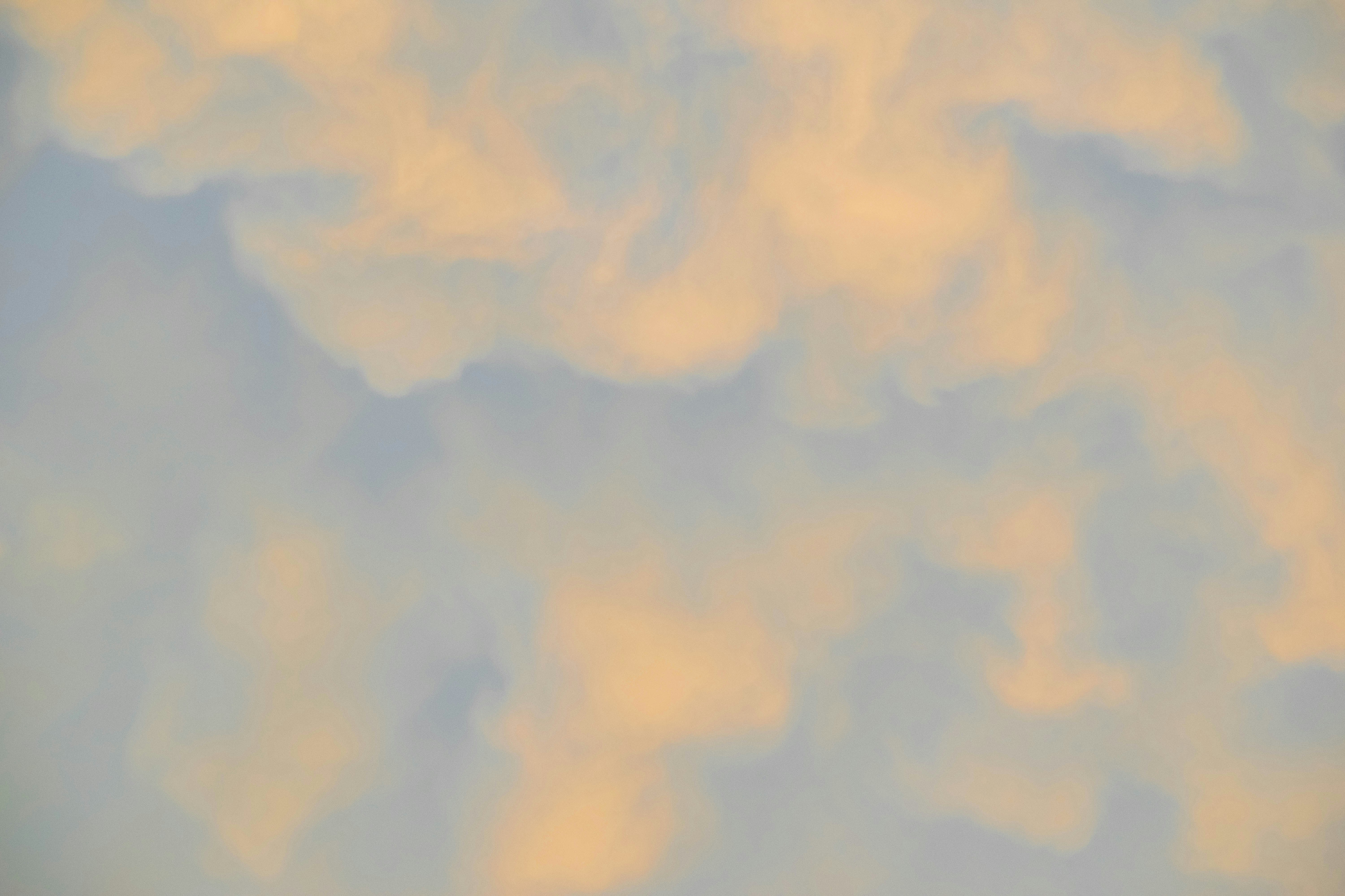Cloudscape in Soft Evening Light Over Calm Sky
