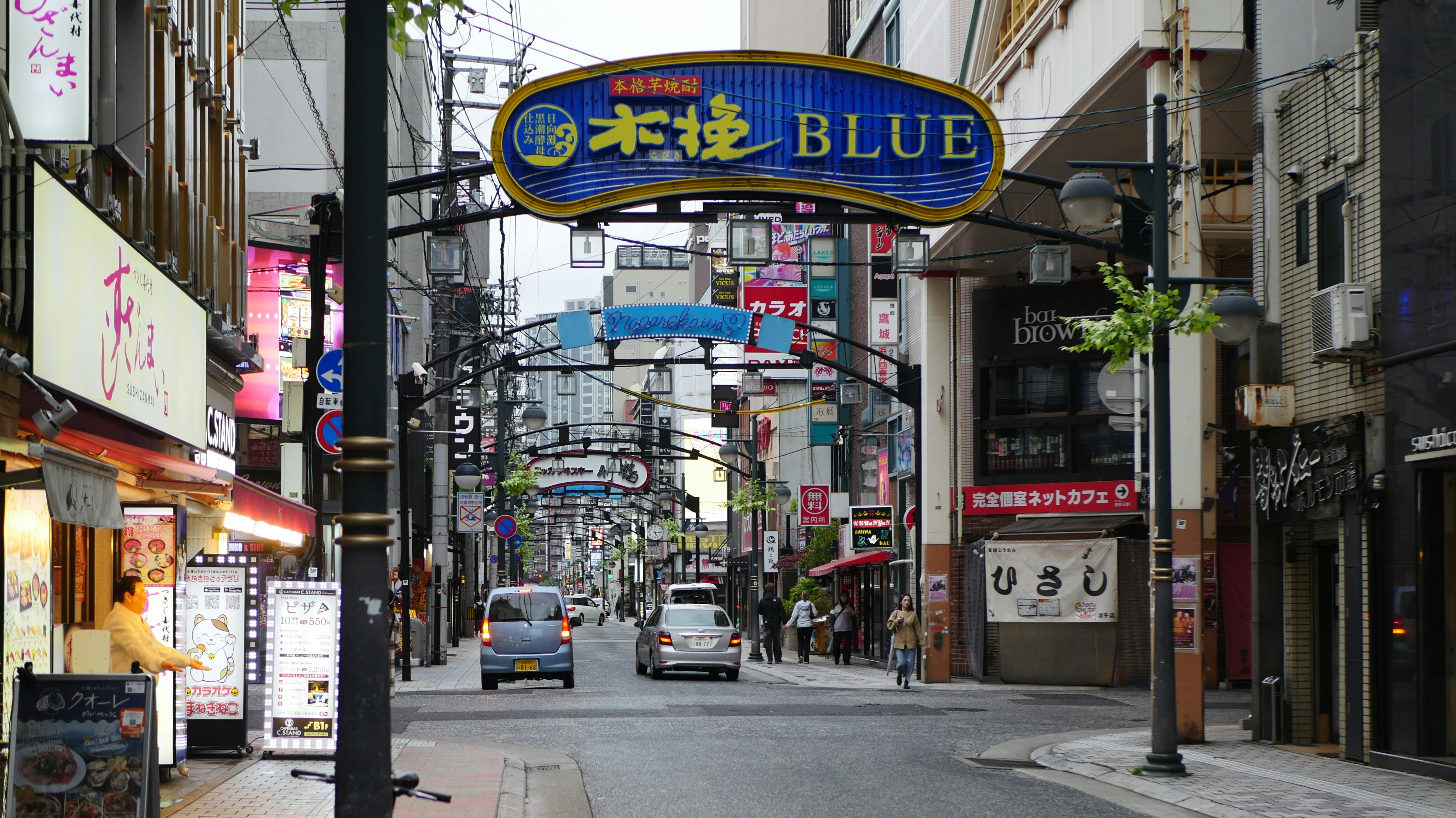 Blue Neon Gateway: A Quiet Street Through Tokyo's Shoppers Block