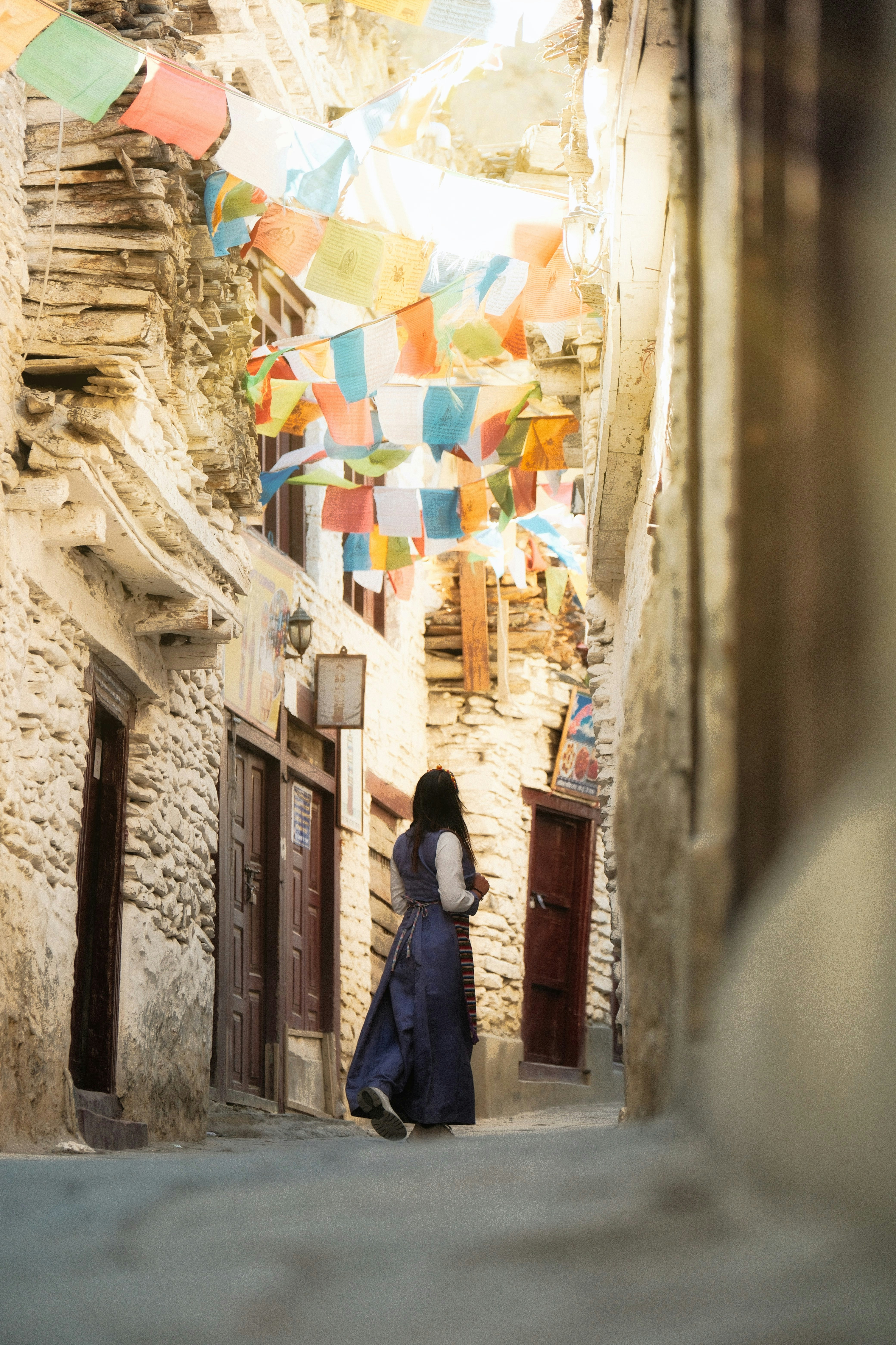 Quiet Wanderer Beneath the Prayer Flags