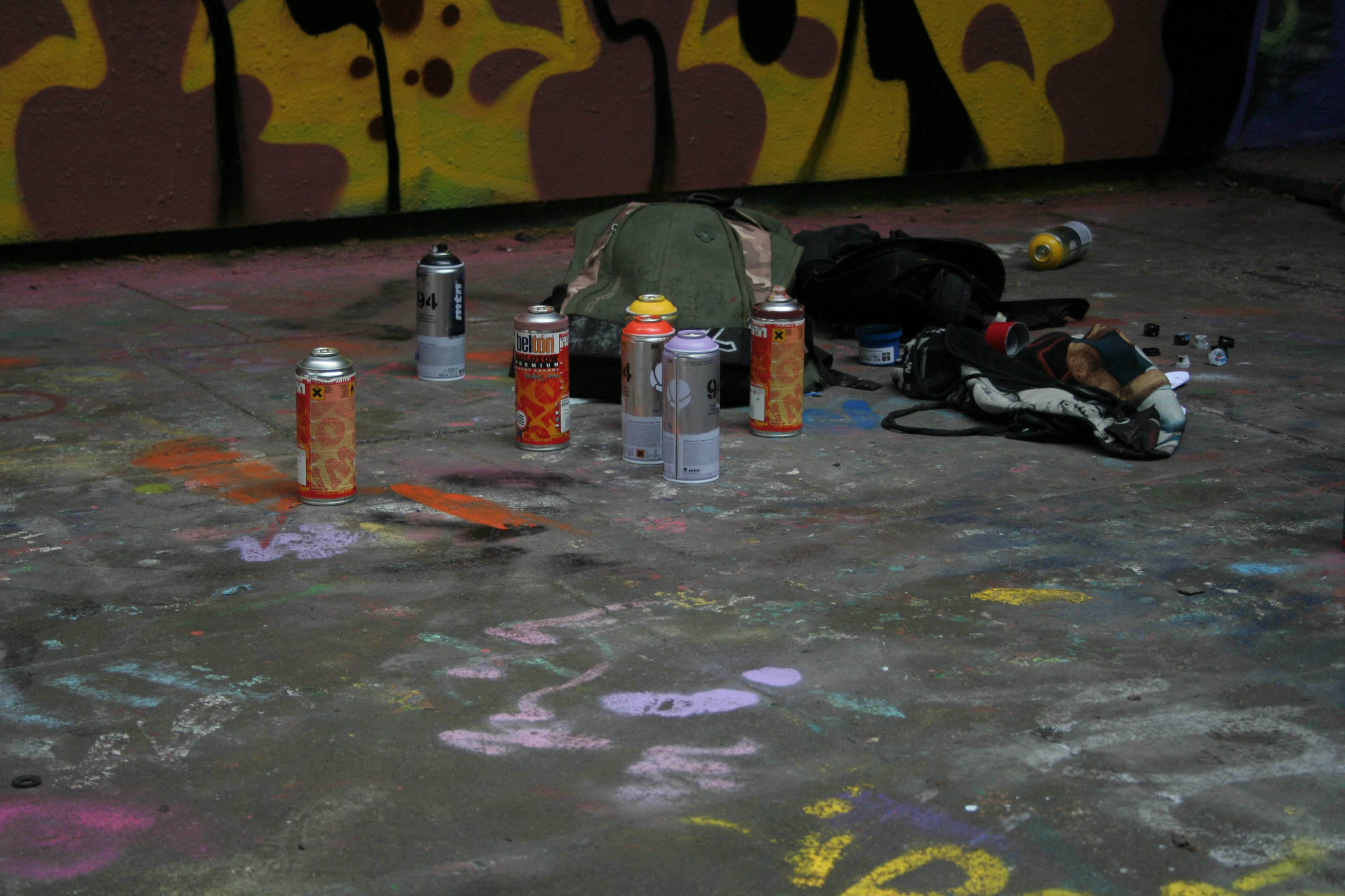 Graffiti Alley Tools: A Palette of Spray Cans and Hidden Gear