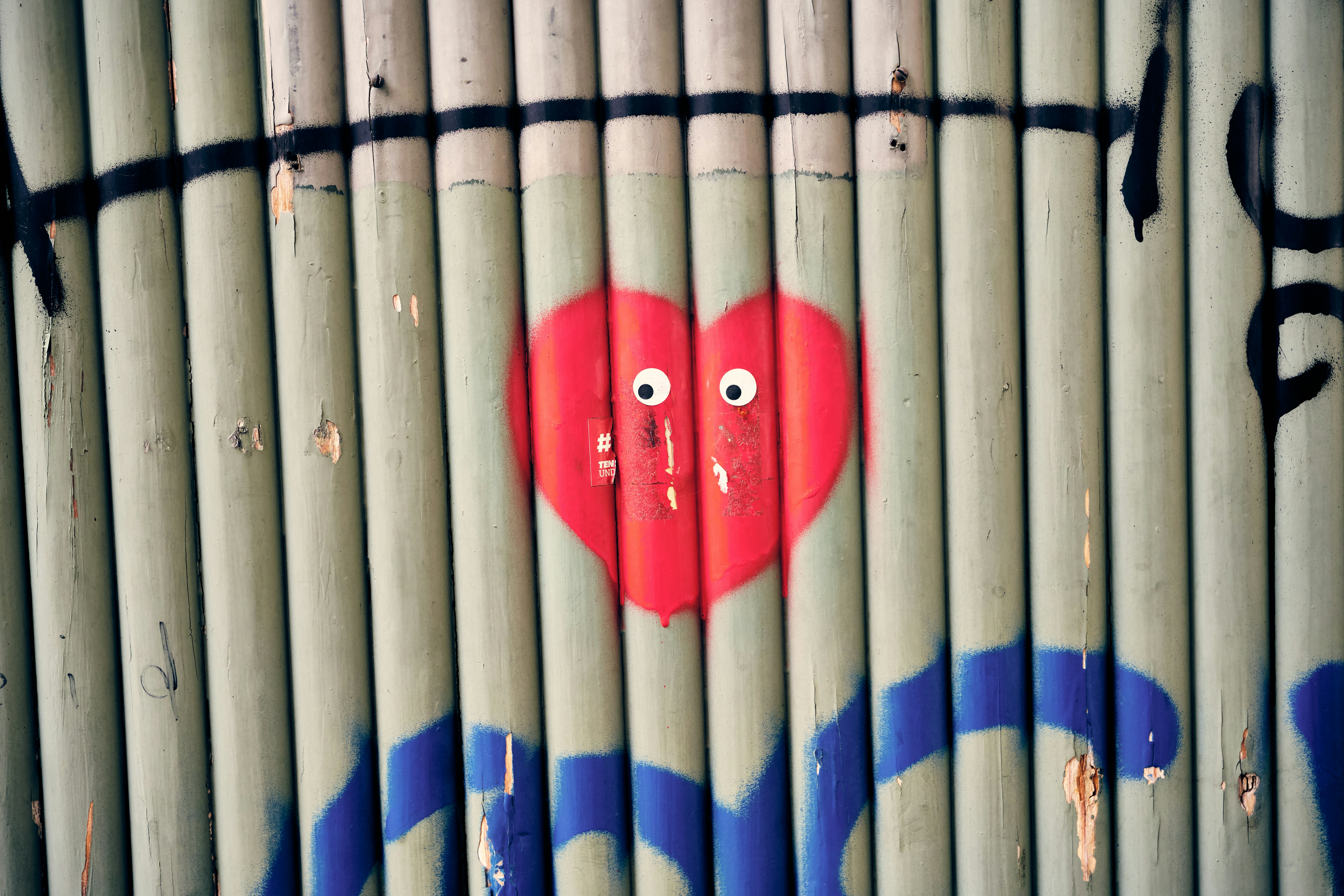 Heart Spray: A Fiery Graffiti Kiss on Metal Slats