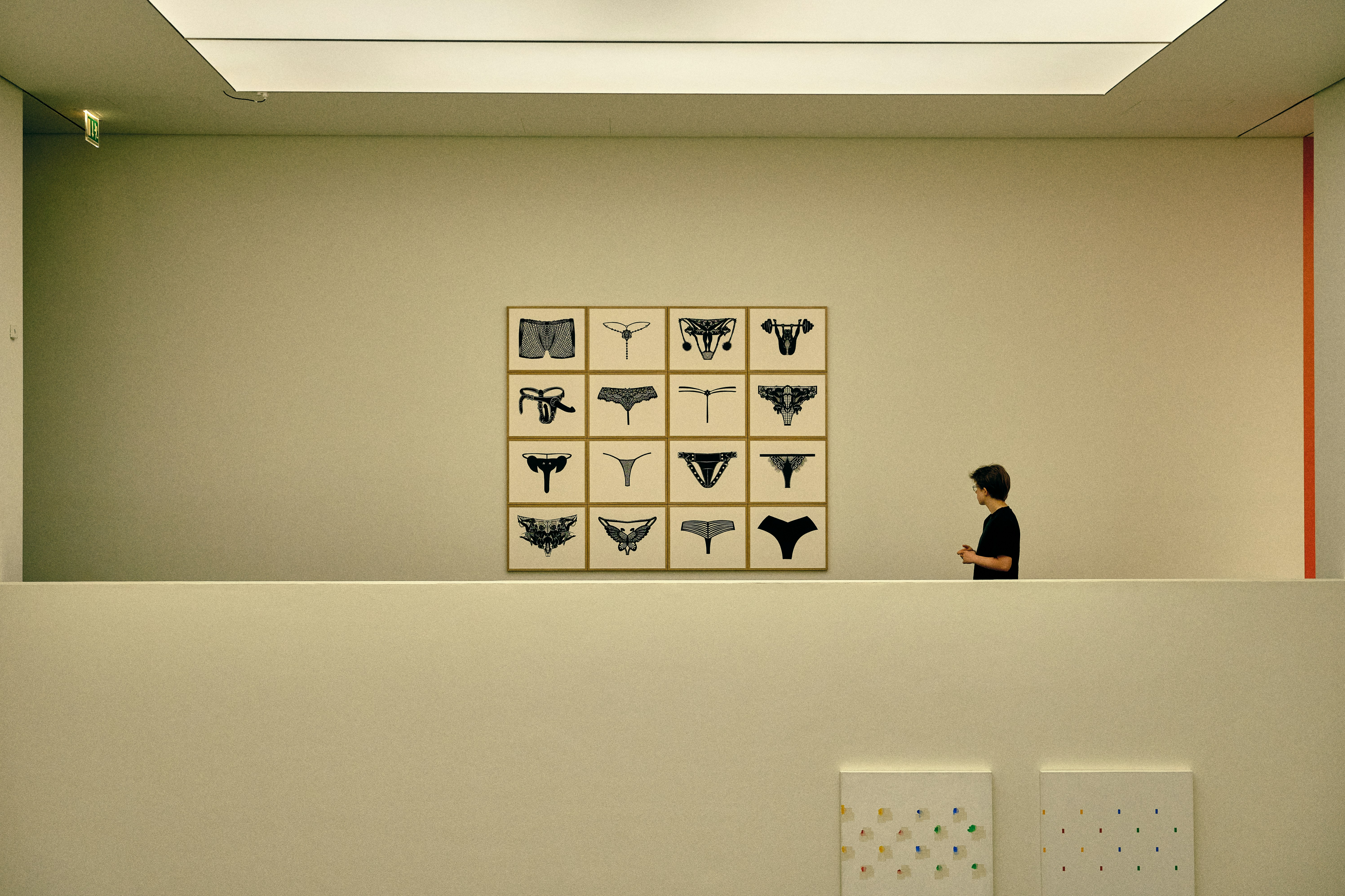Balanced Silence: A Visitor Admires Geometric Wings