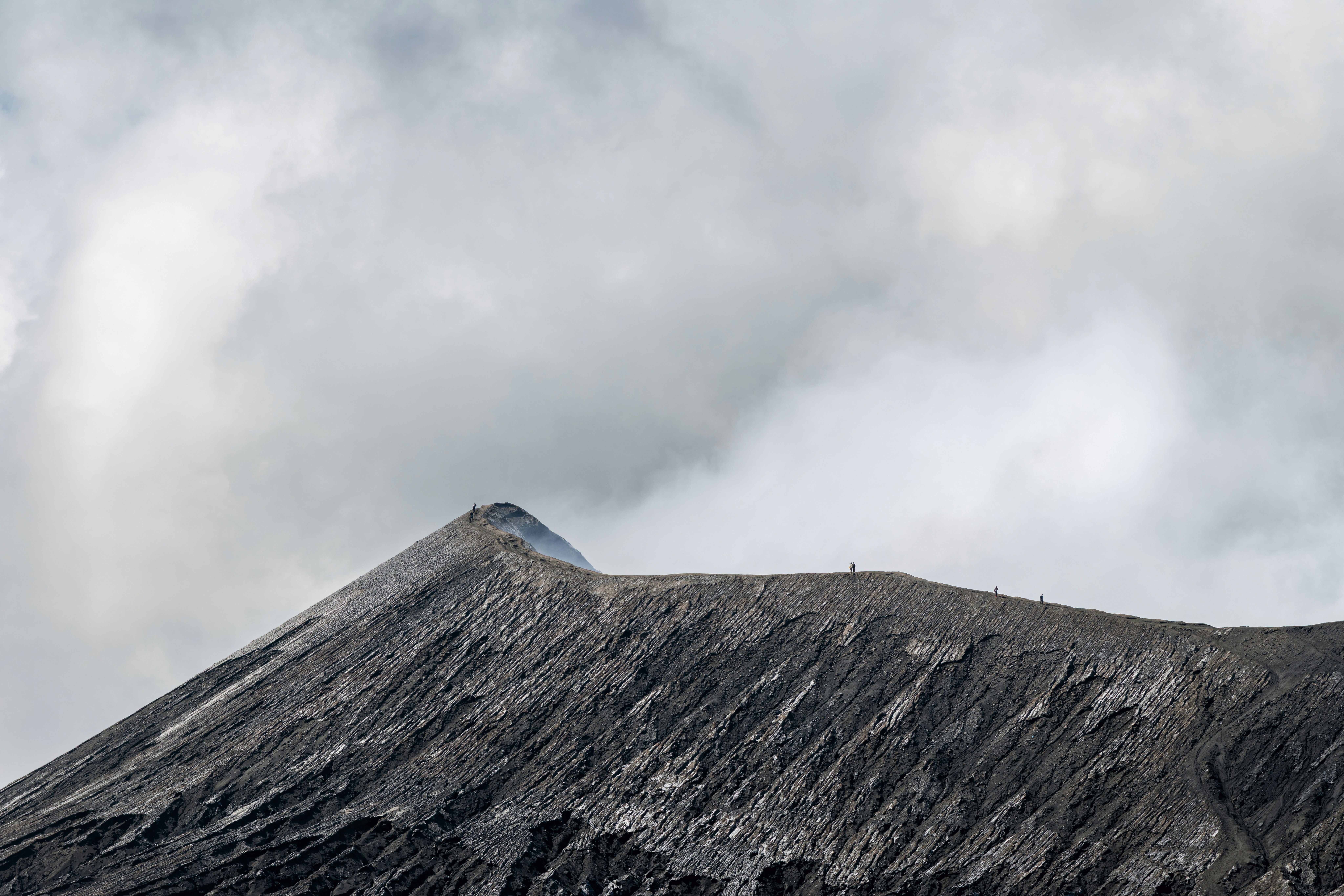 The Summit Wedge: Quiet Ridge under a Crown of Clouds