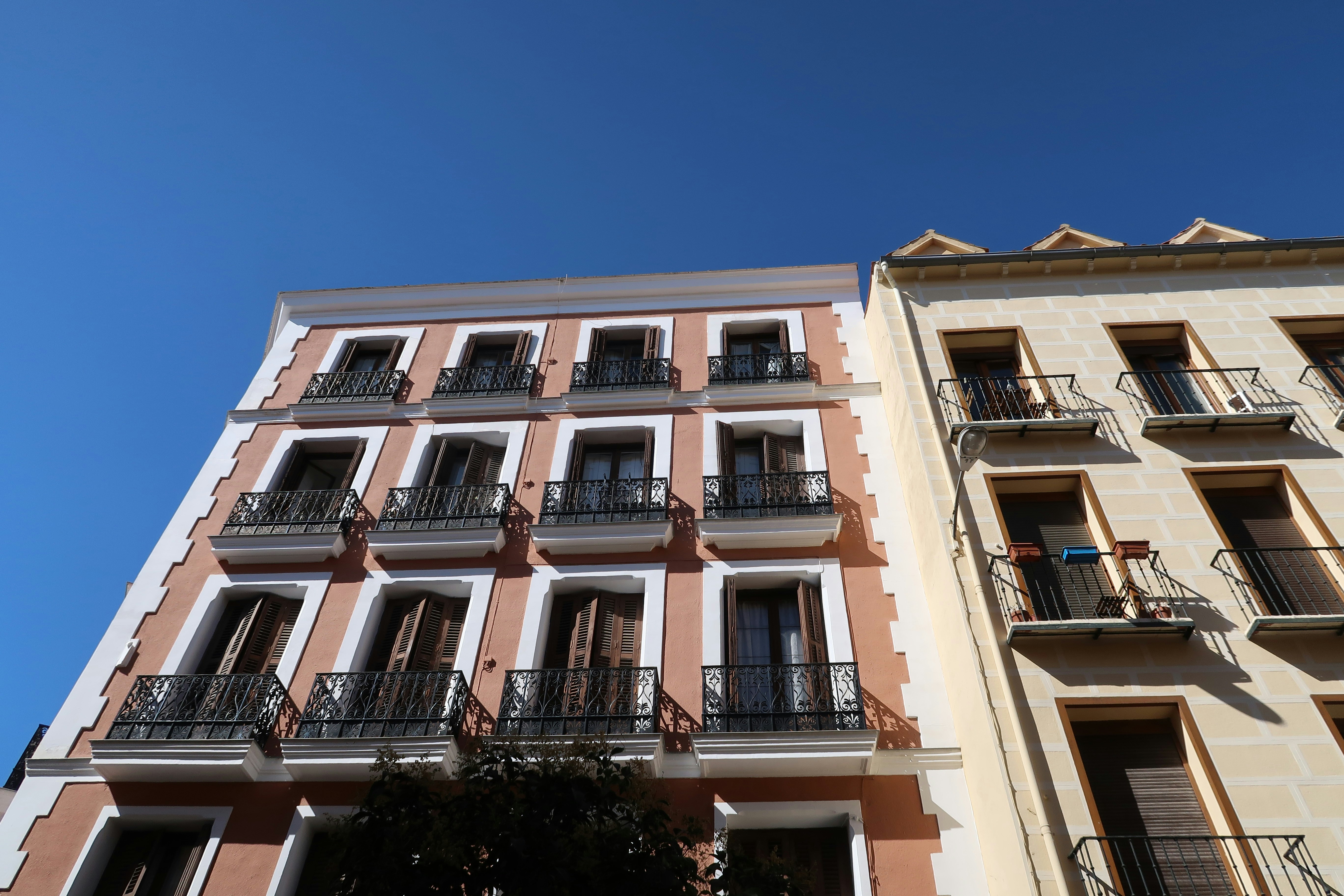 Facade Elegance: A Cornered Street of Balconied Squares