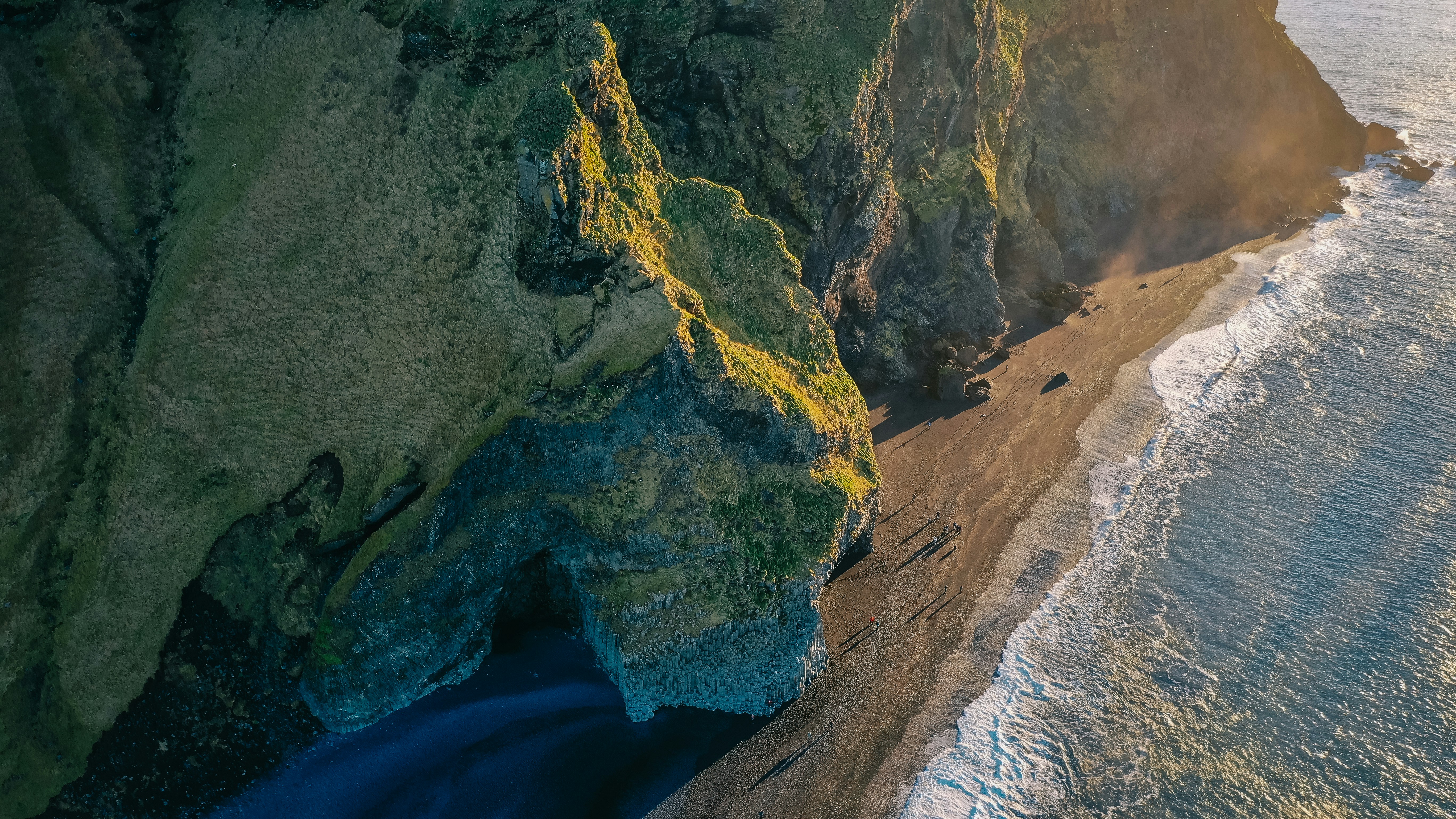Coastal Cliffline Casting Long Shadows on a Quiet Beach