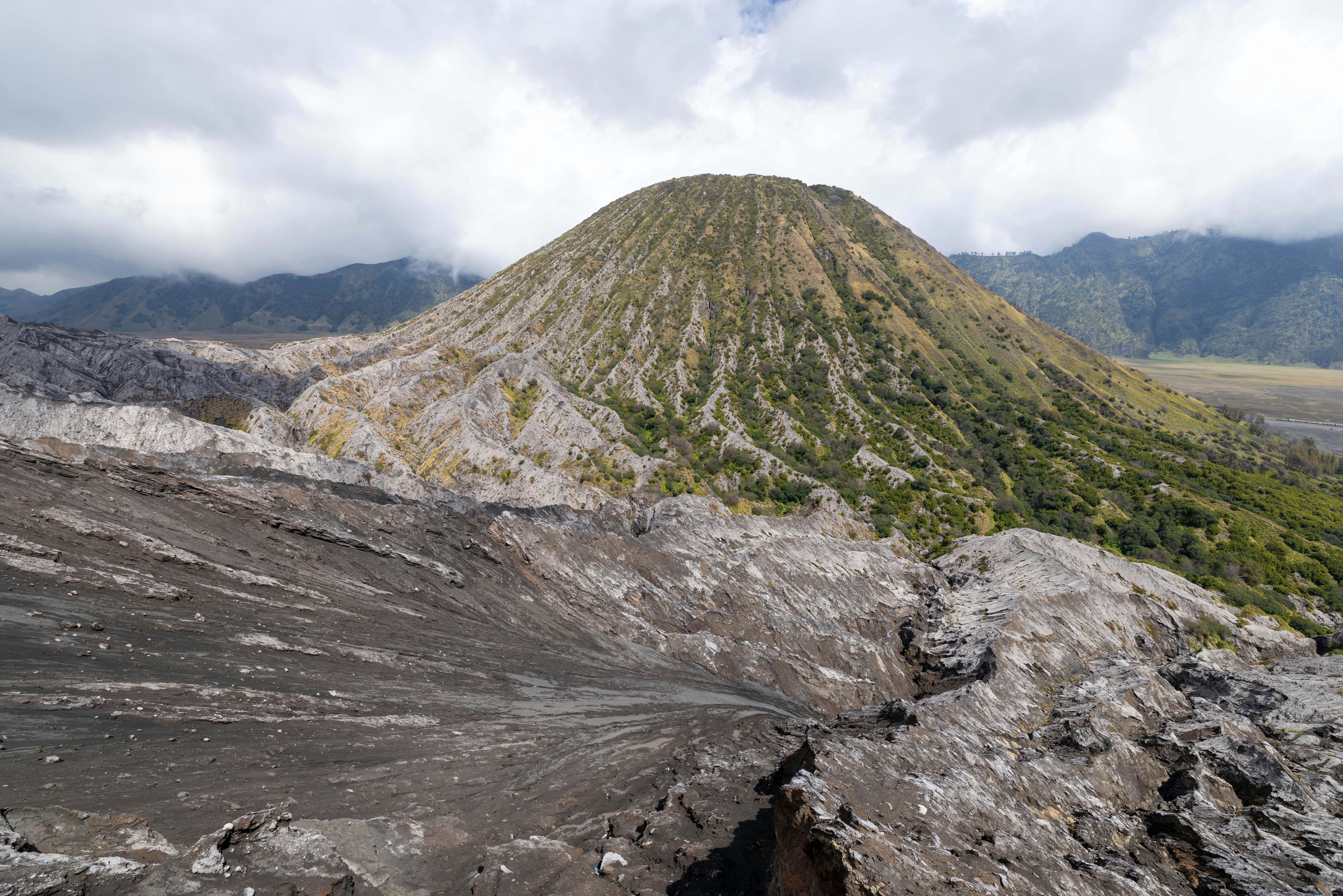 Cone of Quiet Fire: A Lonely Volcano Crowned by Weathered Rims