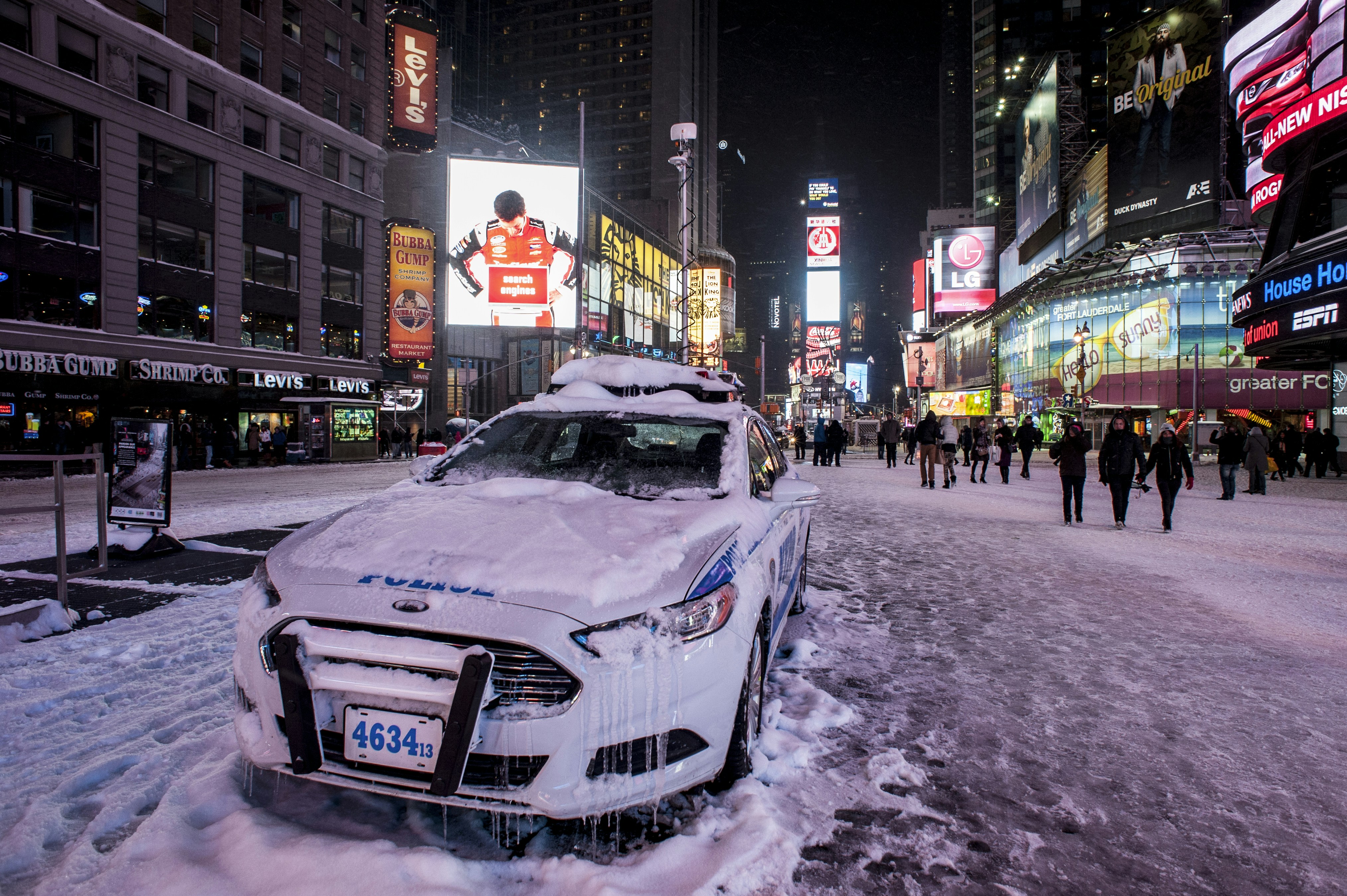 Snowbound Street: Police Car in Neon Midtown Night