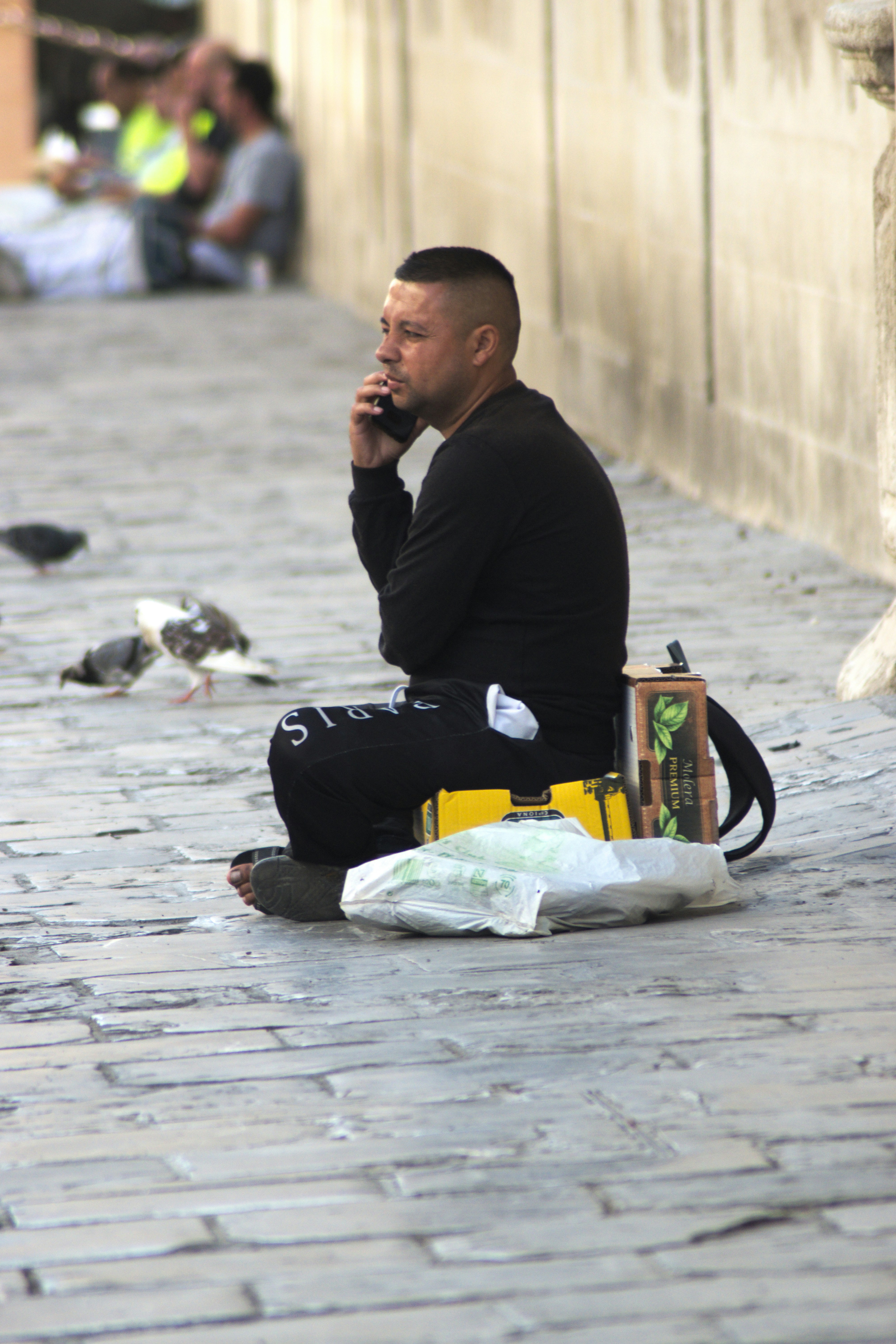 Street Silence: A Pensive Moment on the Cobblestones