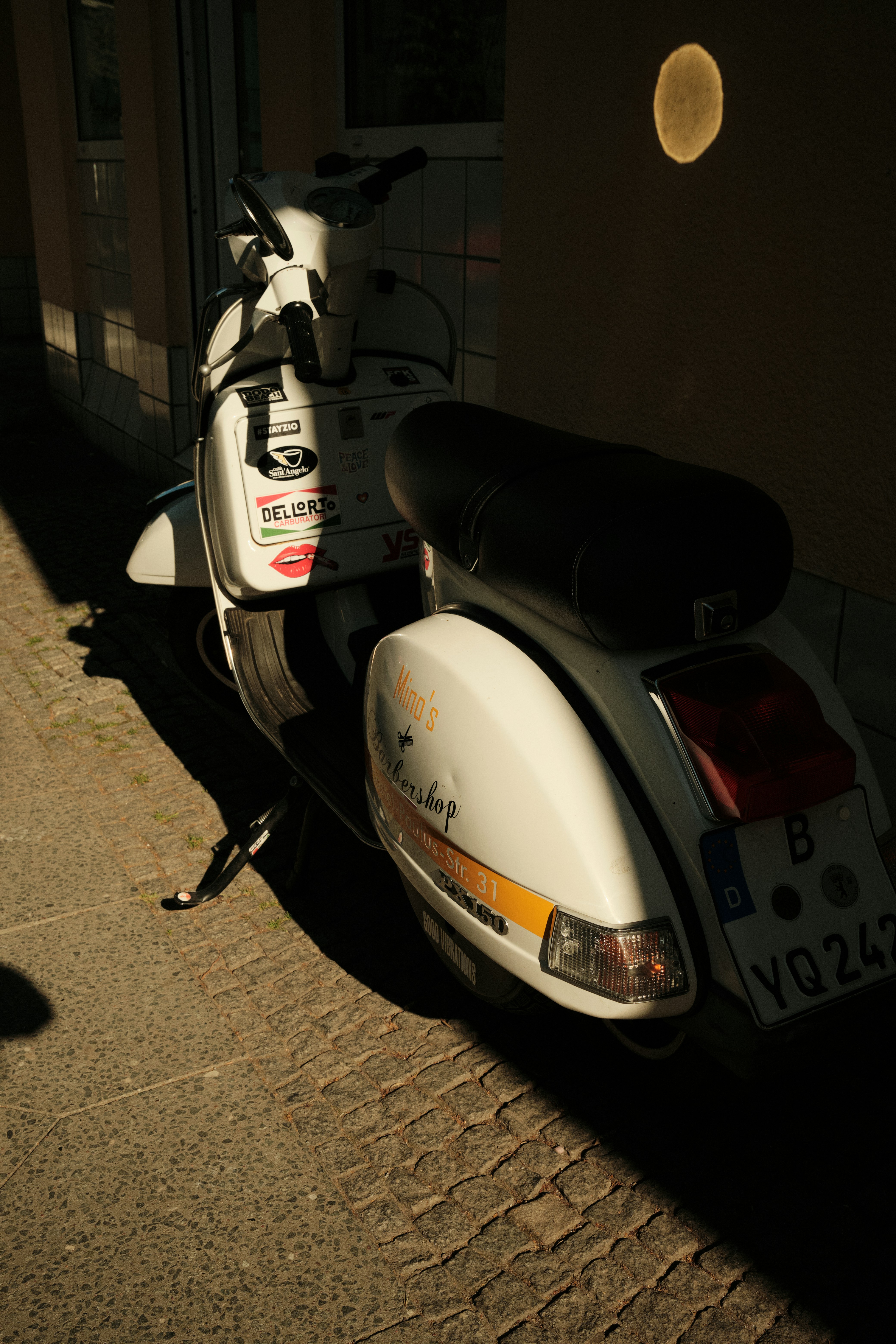 Sunlit Vespa in Partial Shadow