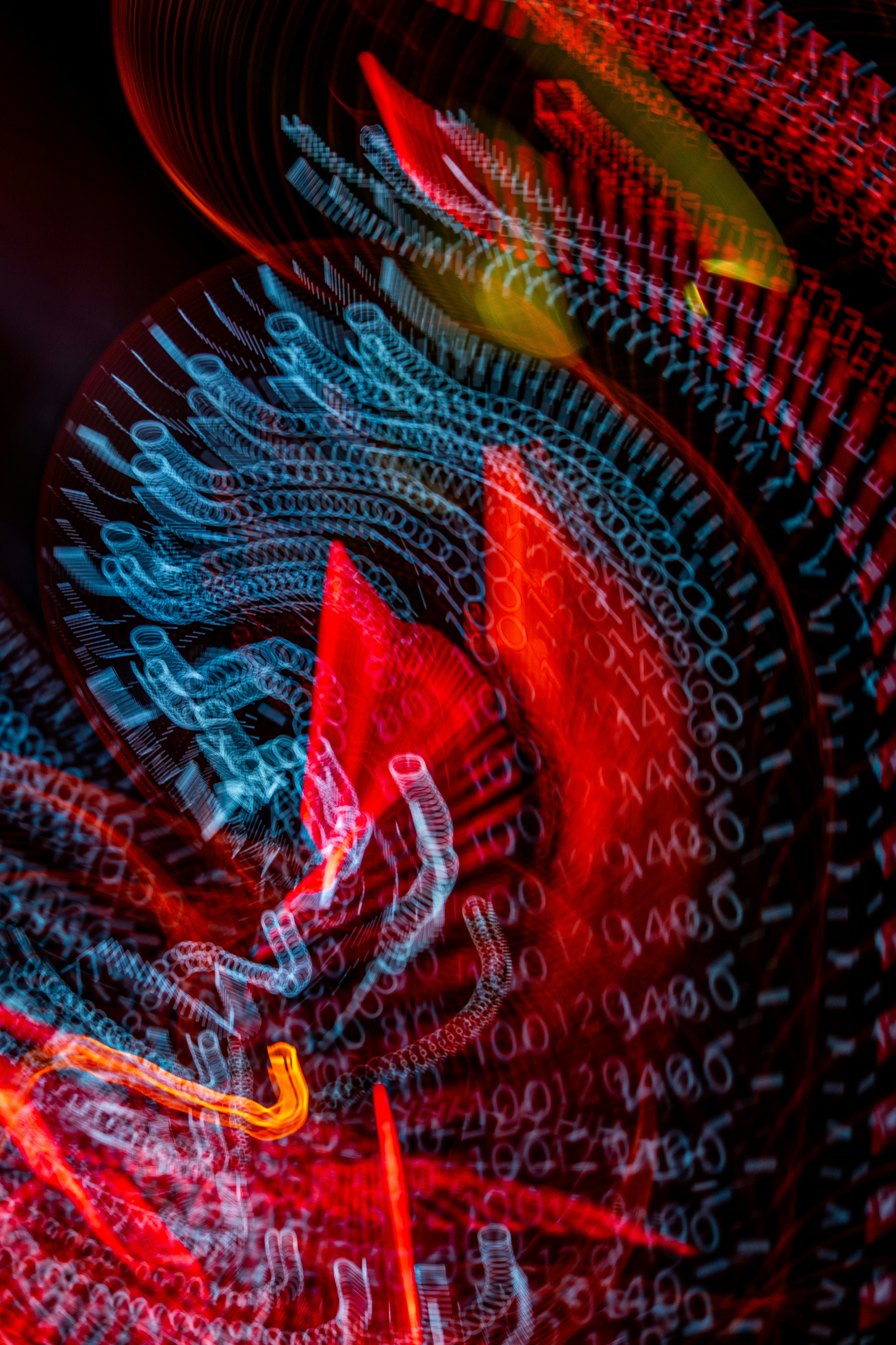 Abstract neon light trails and binary numerals swirl in red and blue, suggesting digital energy and motion; the composition leans into a technical, data-driven aesthetic.
