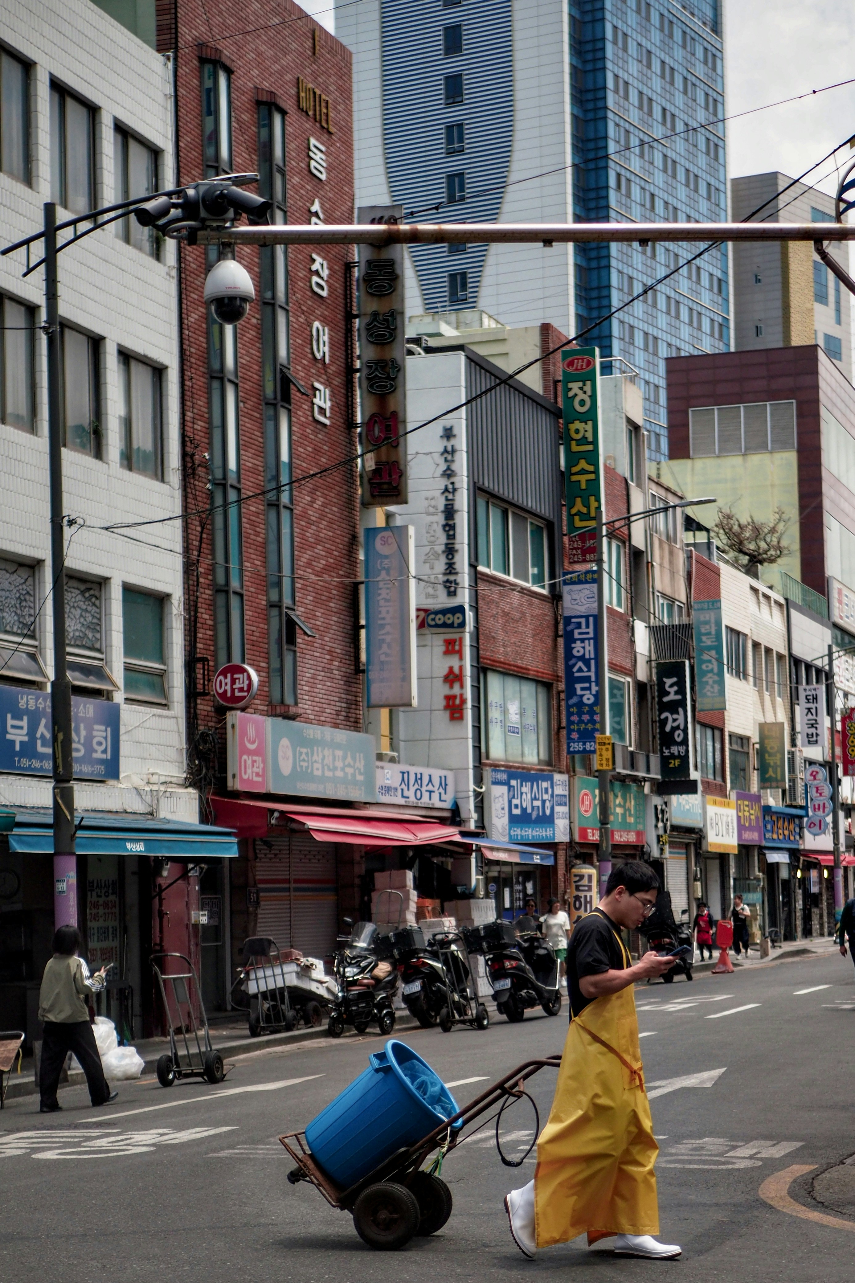 Street Portrait Amid a Corridor of Neon signage