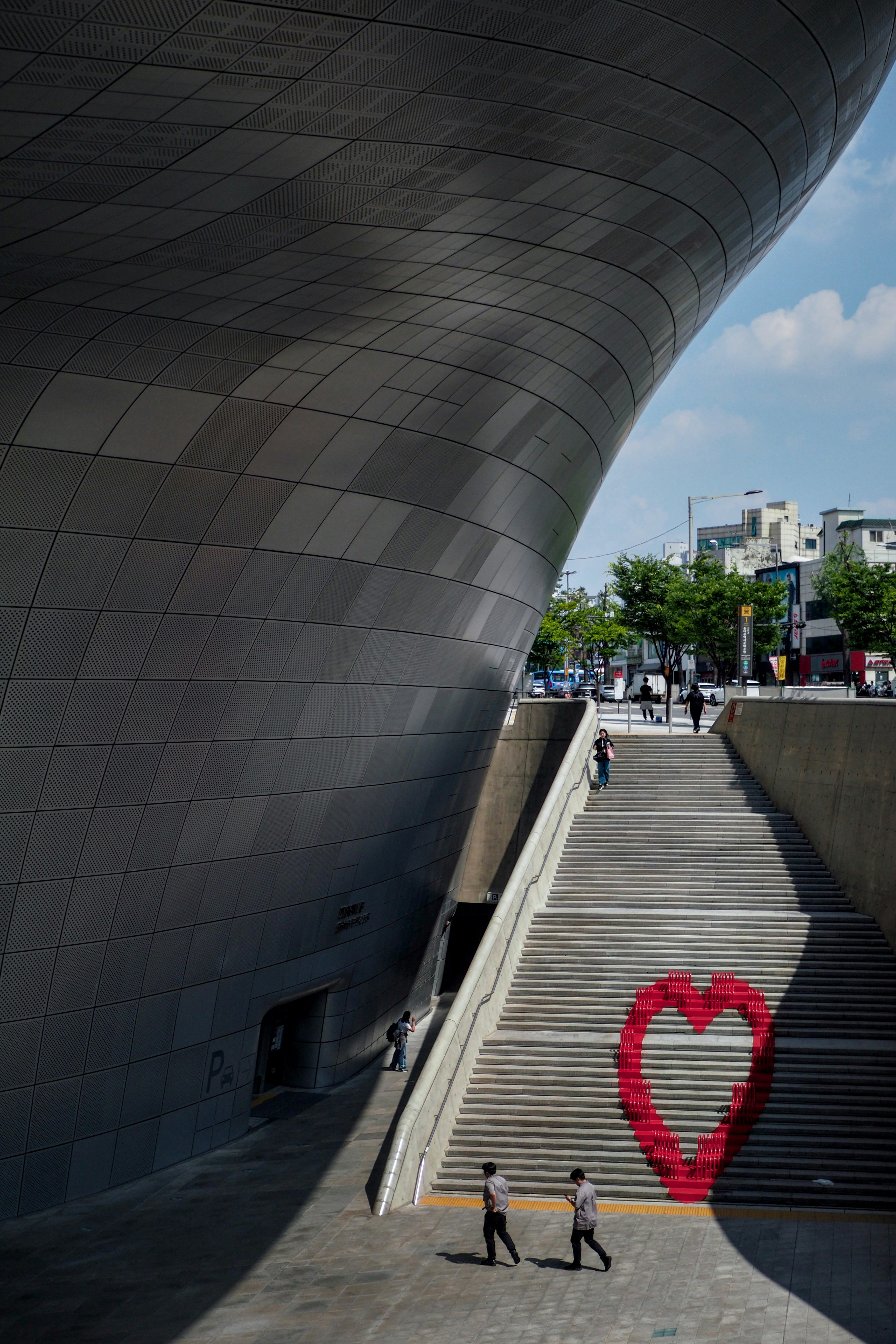 Curved Facade & Heart Graffiti: Staircase to the City
