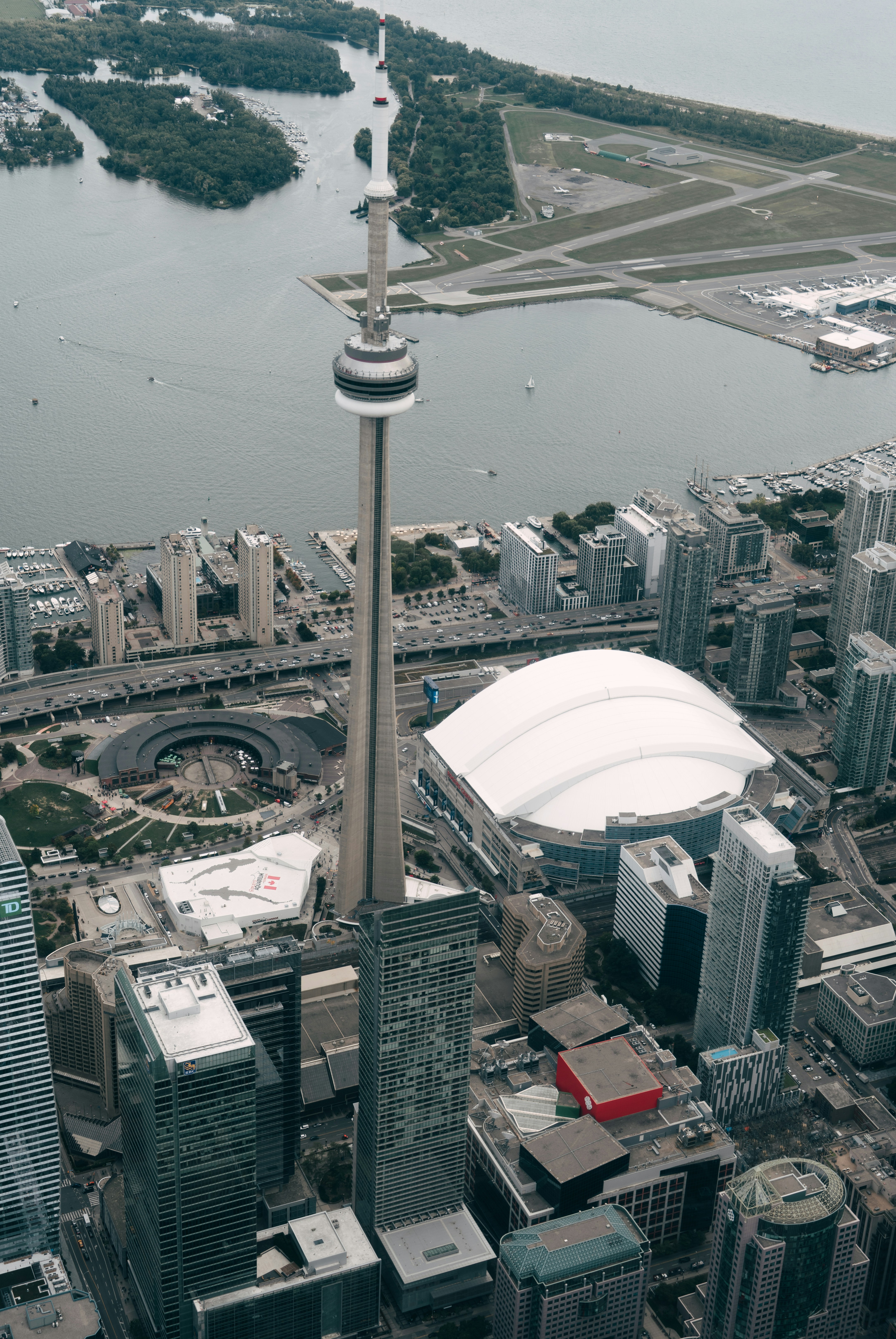 Skyscraper Spire Piercing a Grey City: Toronto from Above