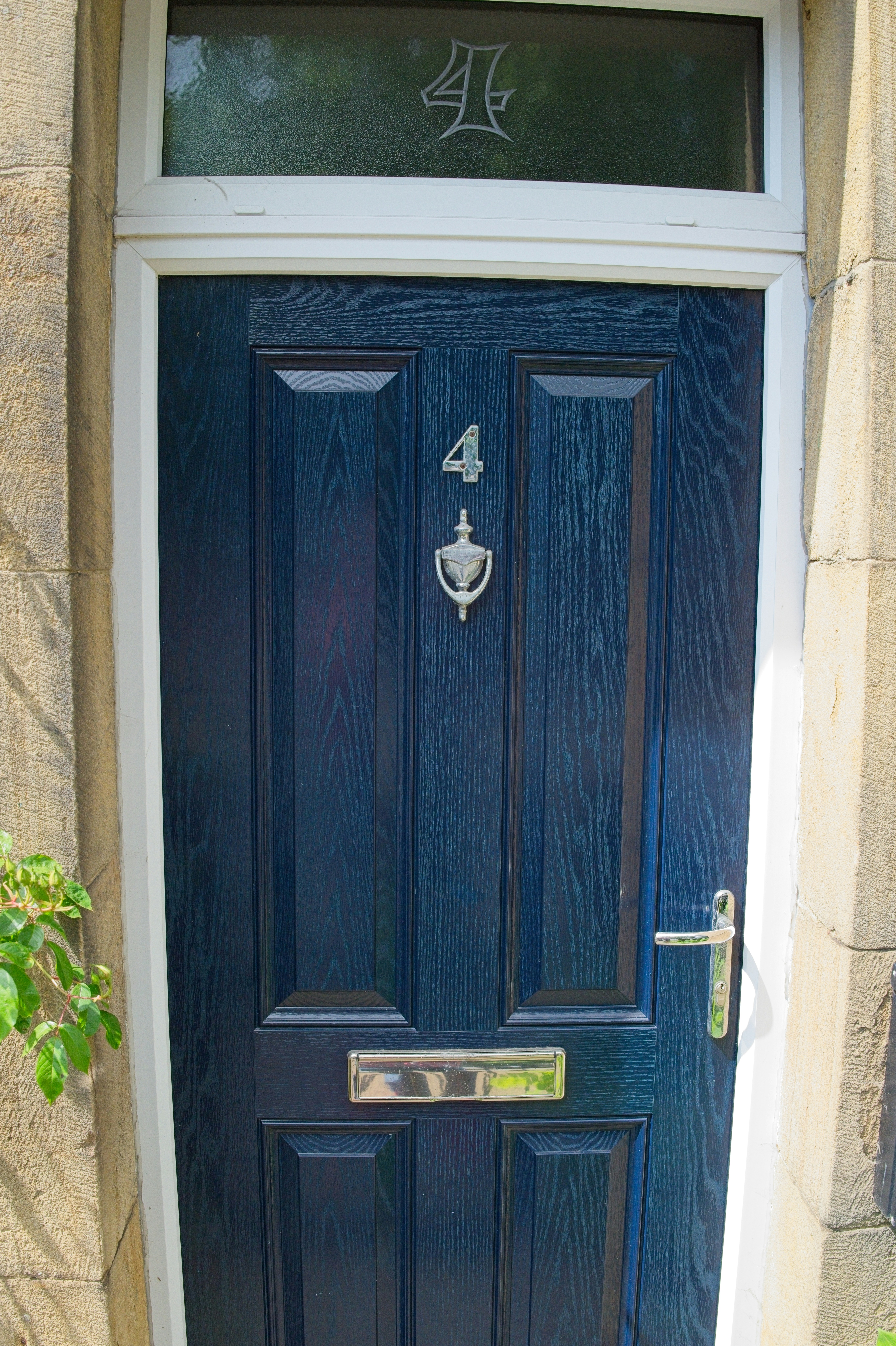 Blue Door with House Number 4 and Ornate Hardware